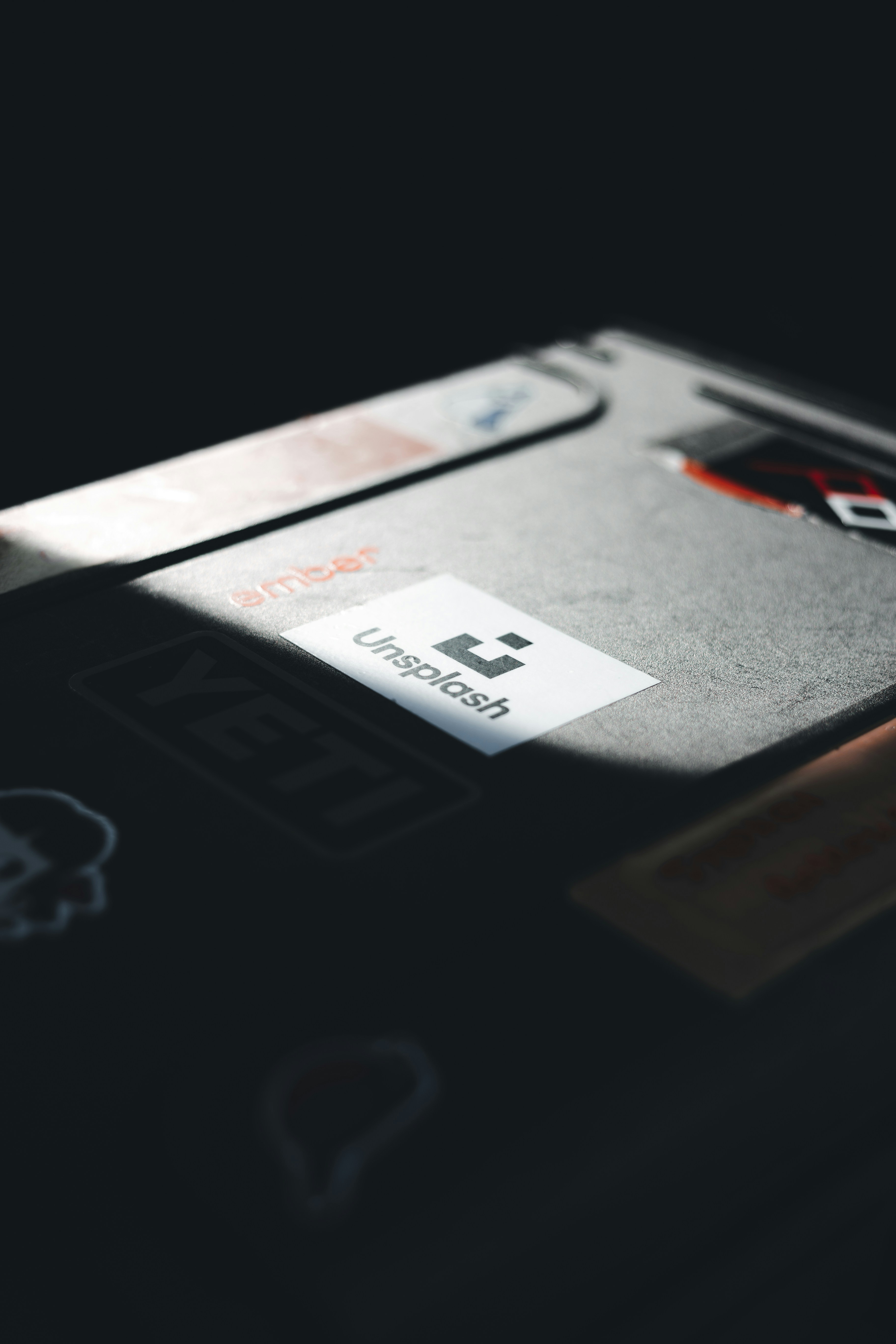 Stickered Surface in Soft Focus: A Quiet Close-Up on a Laptop Lid
