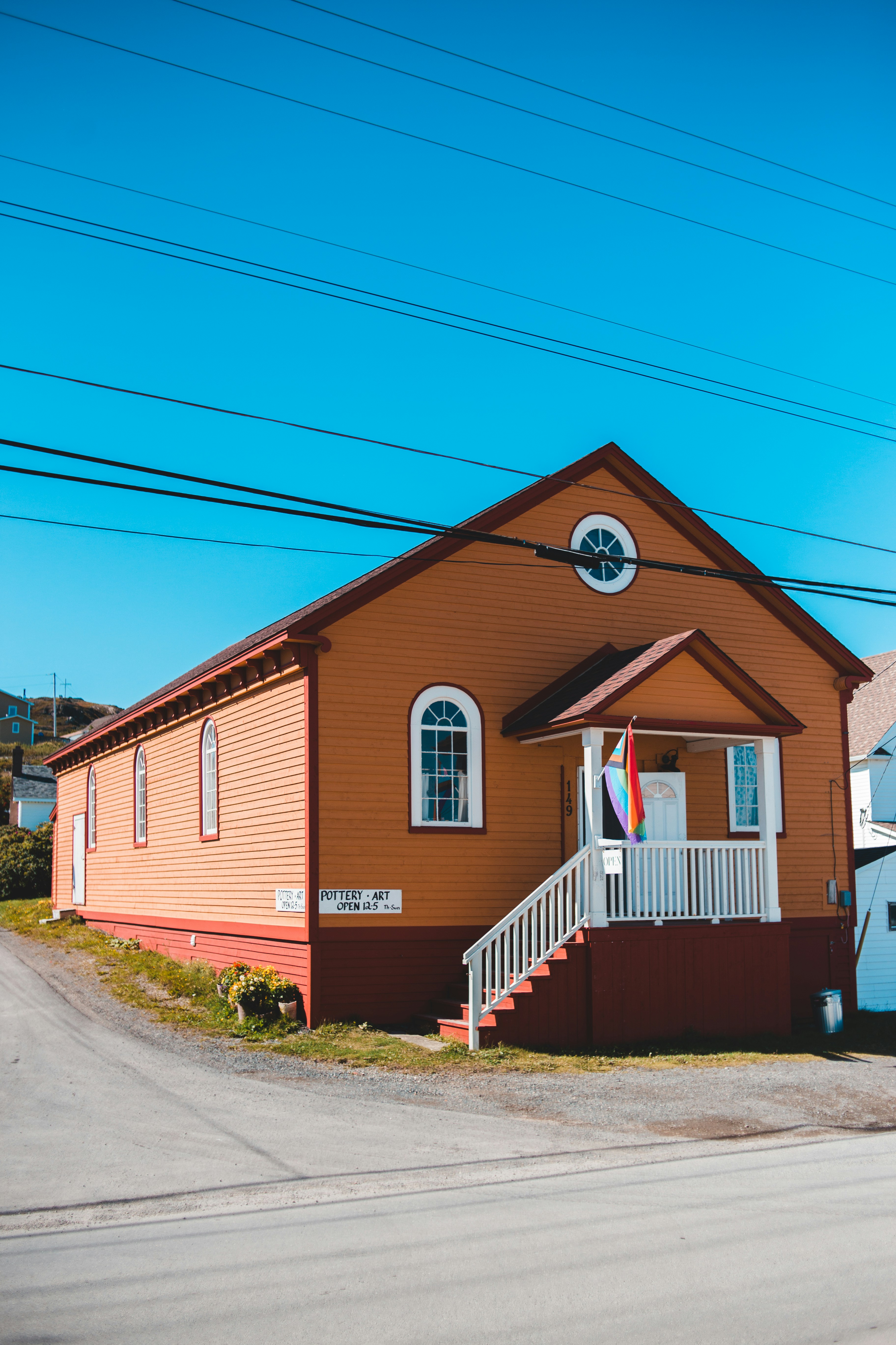 a small church with a flag on the front of it