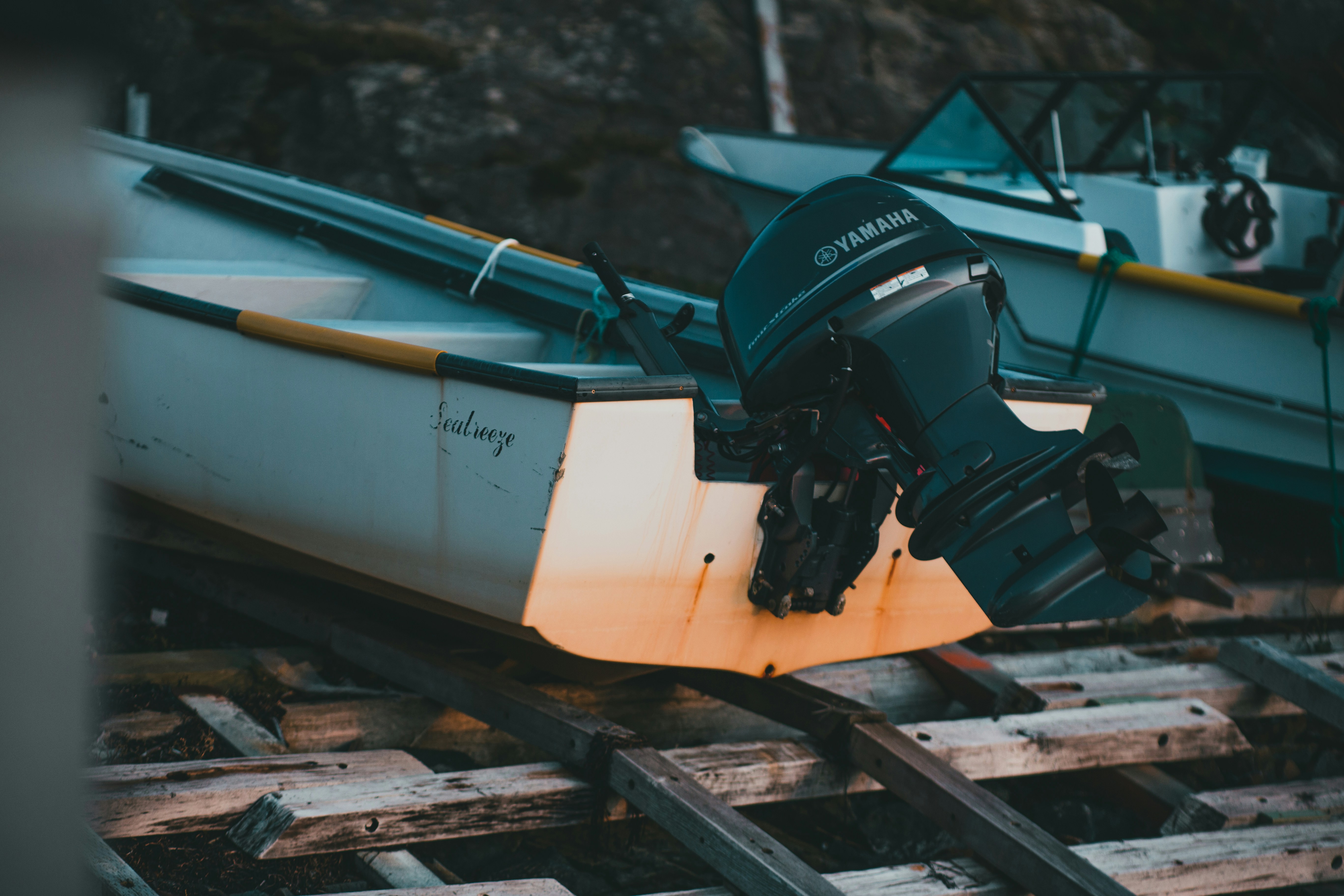 Resting on the Rails: A Weathered Boat Awaiting The Quiet Rest