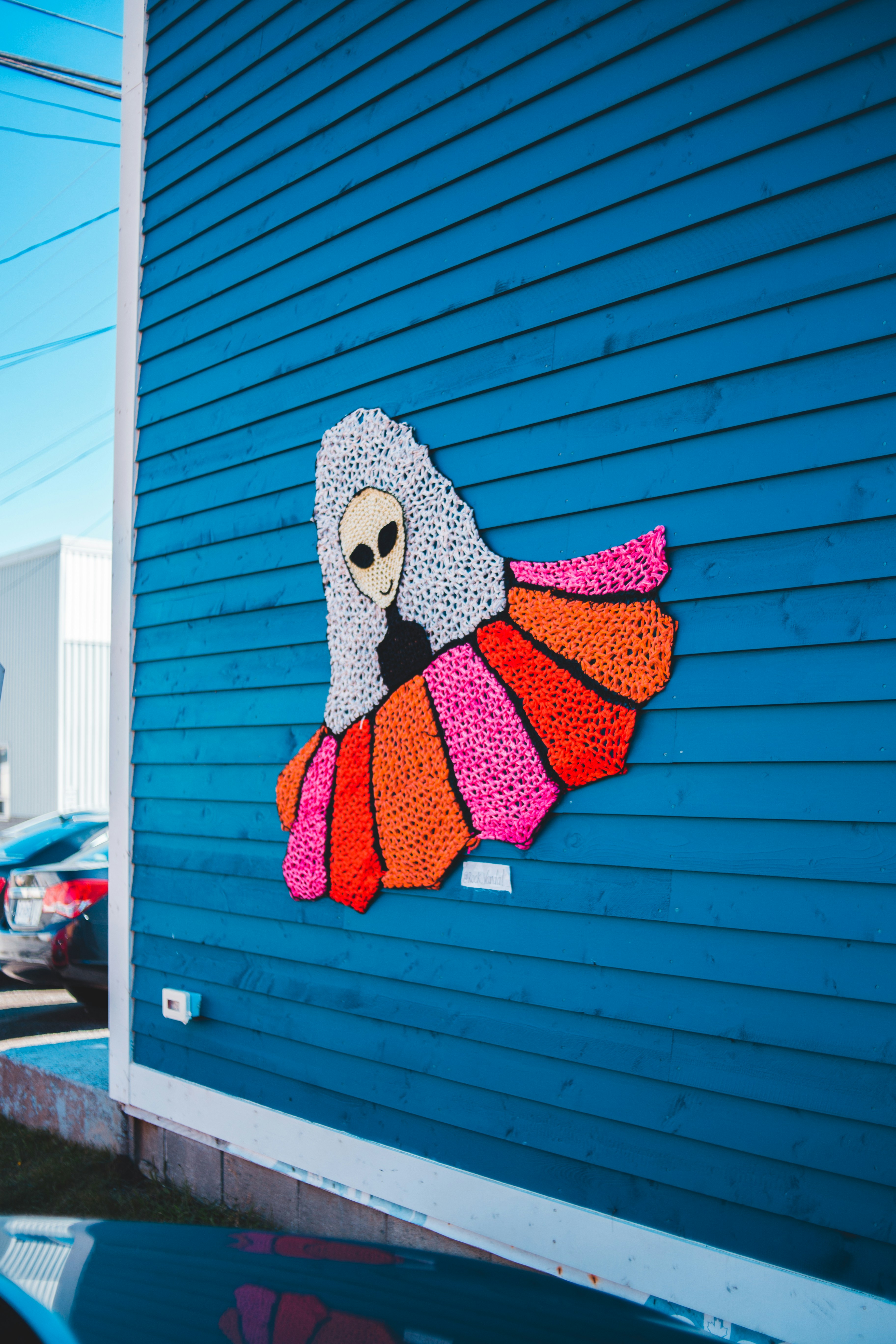 Neon Mosaic Butterfly on Azure Siding