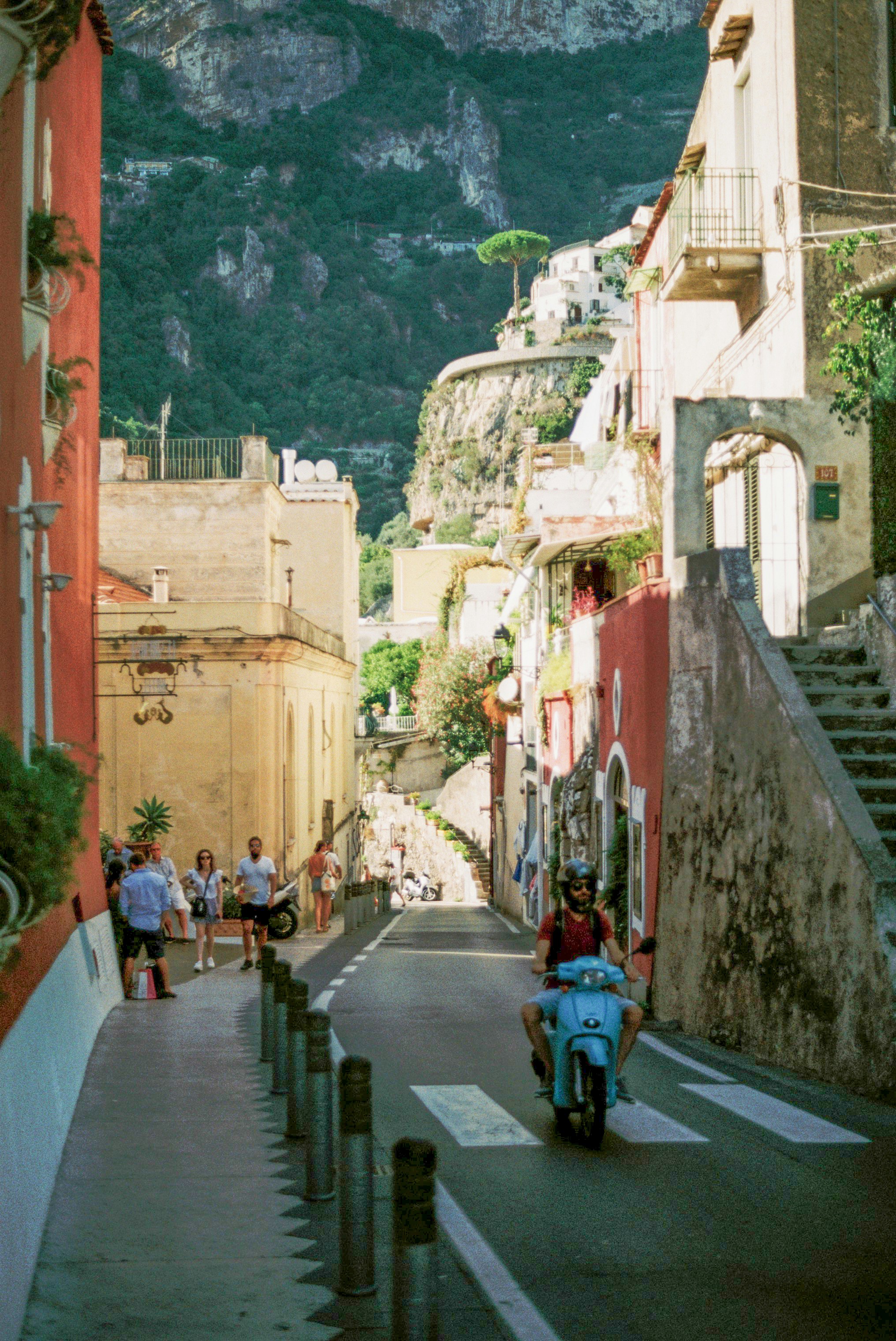 Blue Scooter on a Sunlit Amalfi-Style Hill Street