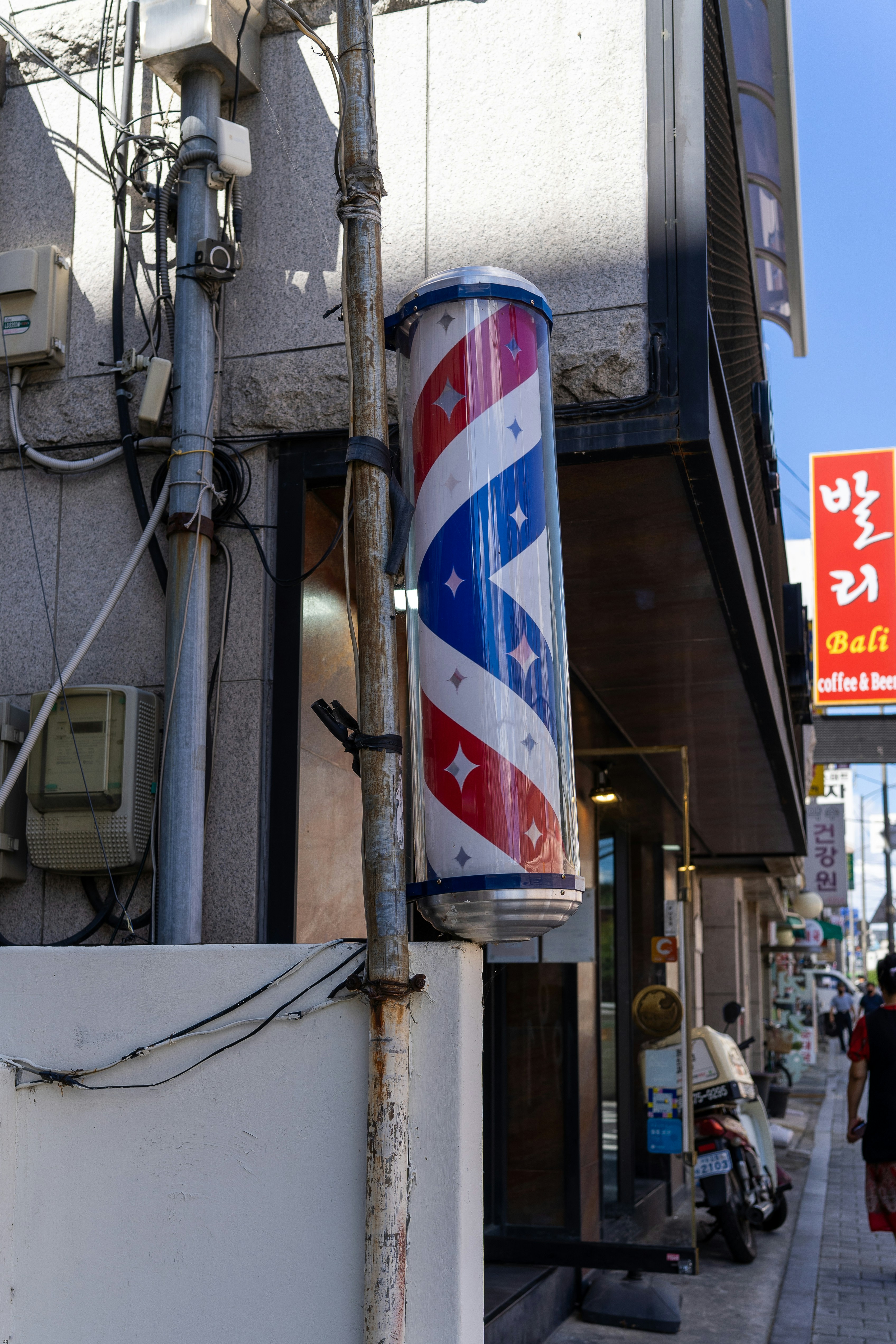 Vintage Barber Pole on Urban Street Corner