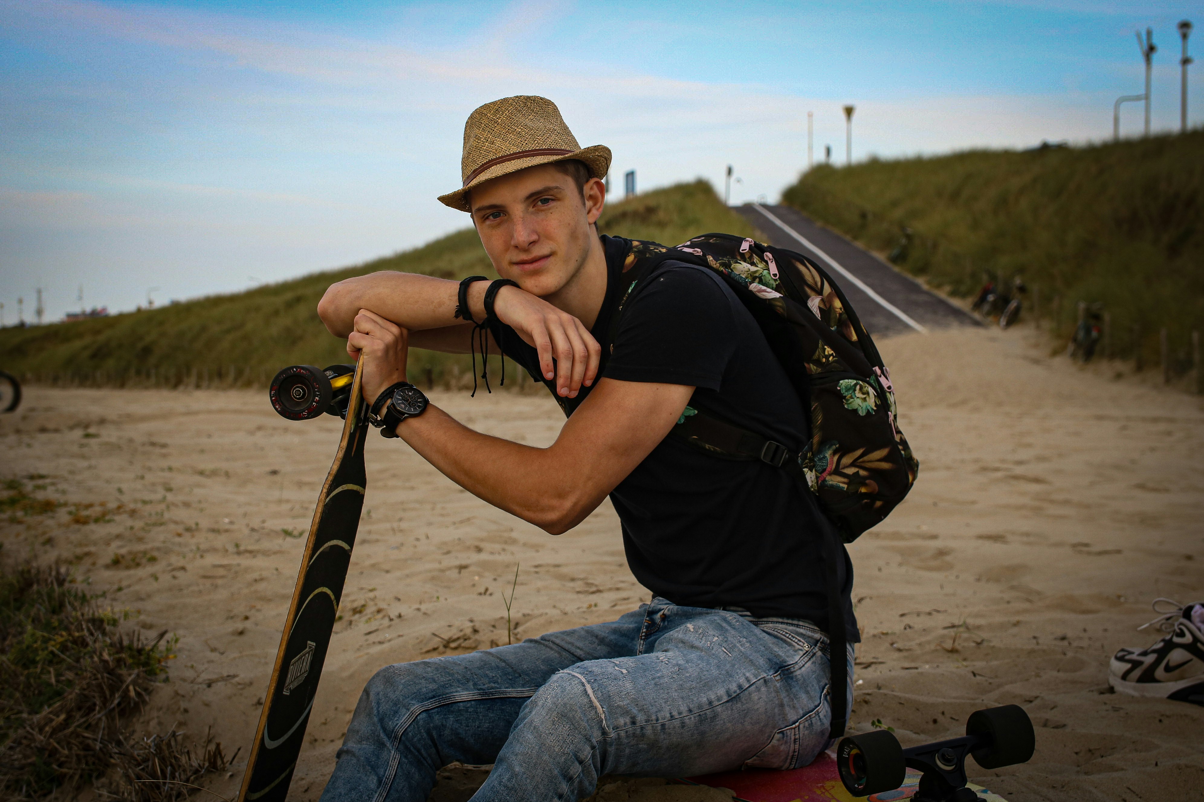 Dune-side Pause: Portrait of a Paddleboarder Ready for the Next Glide