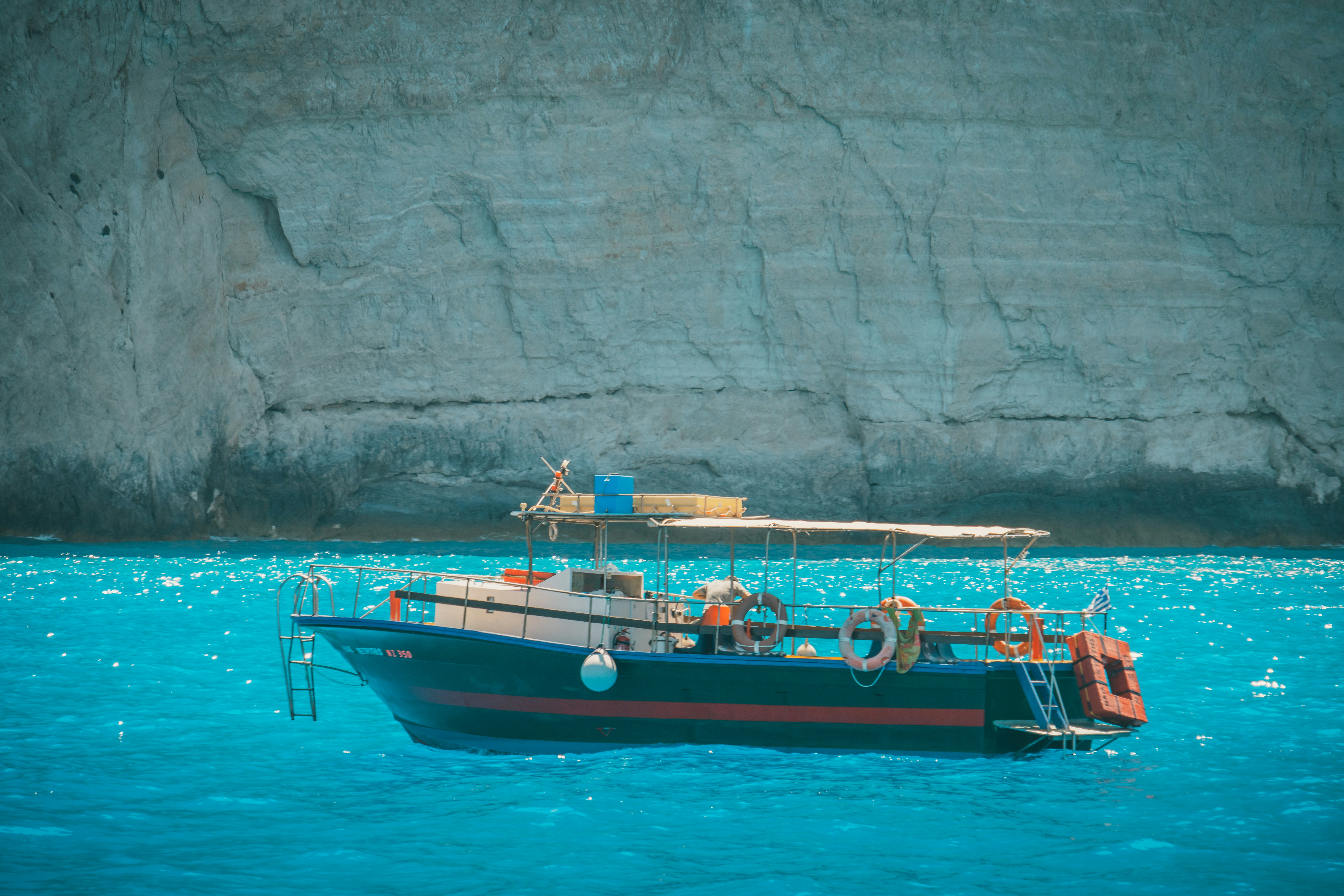 Travel around Greece yachts in Ionic Sea. Turquoise clear water beach travel by yachts catamaran Ionic sea, Greece
