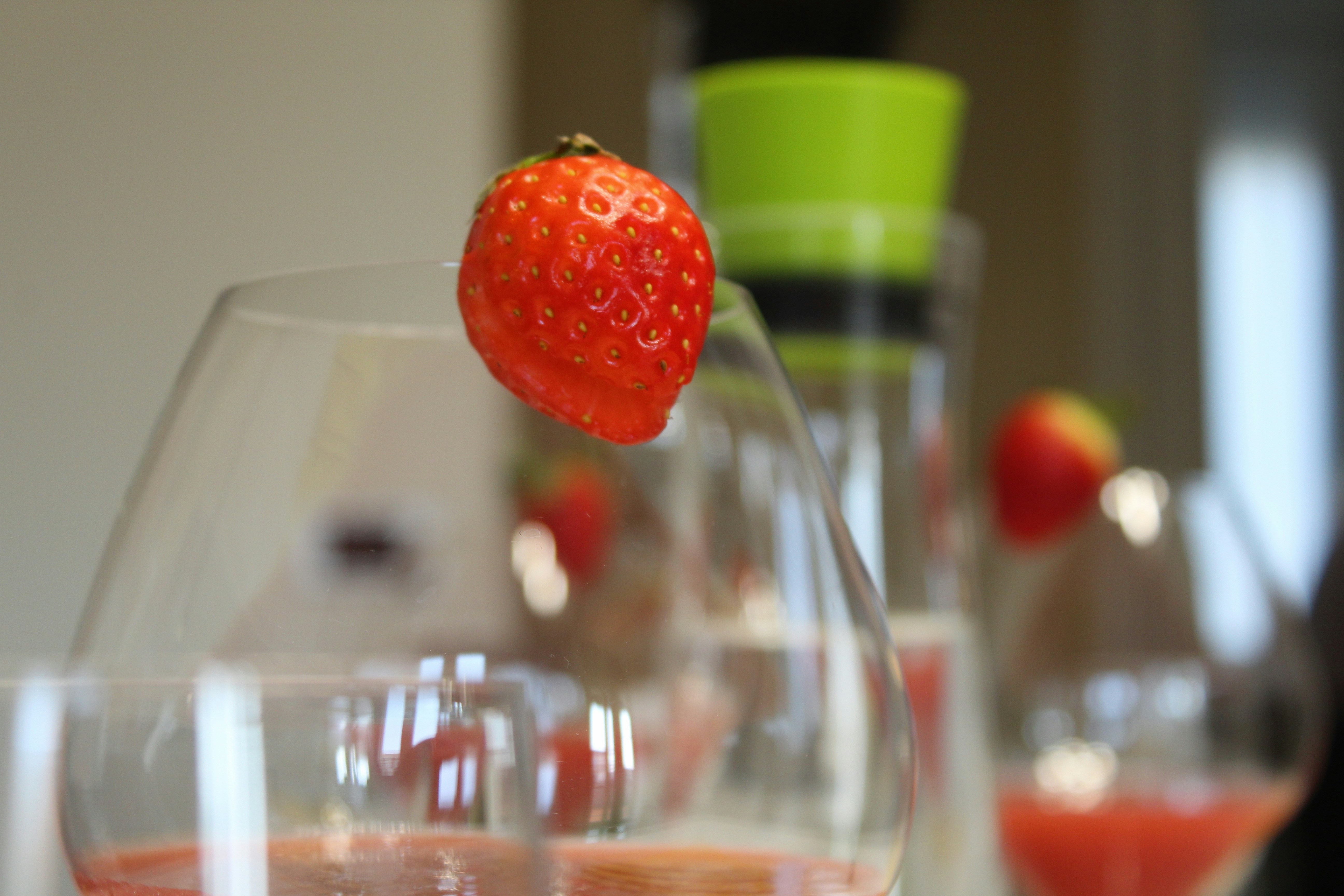 Strawberry Crowned on a Glass Stage Amid Rosé Echoes