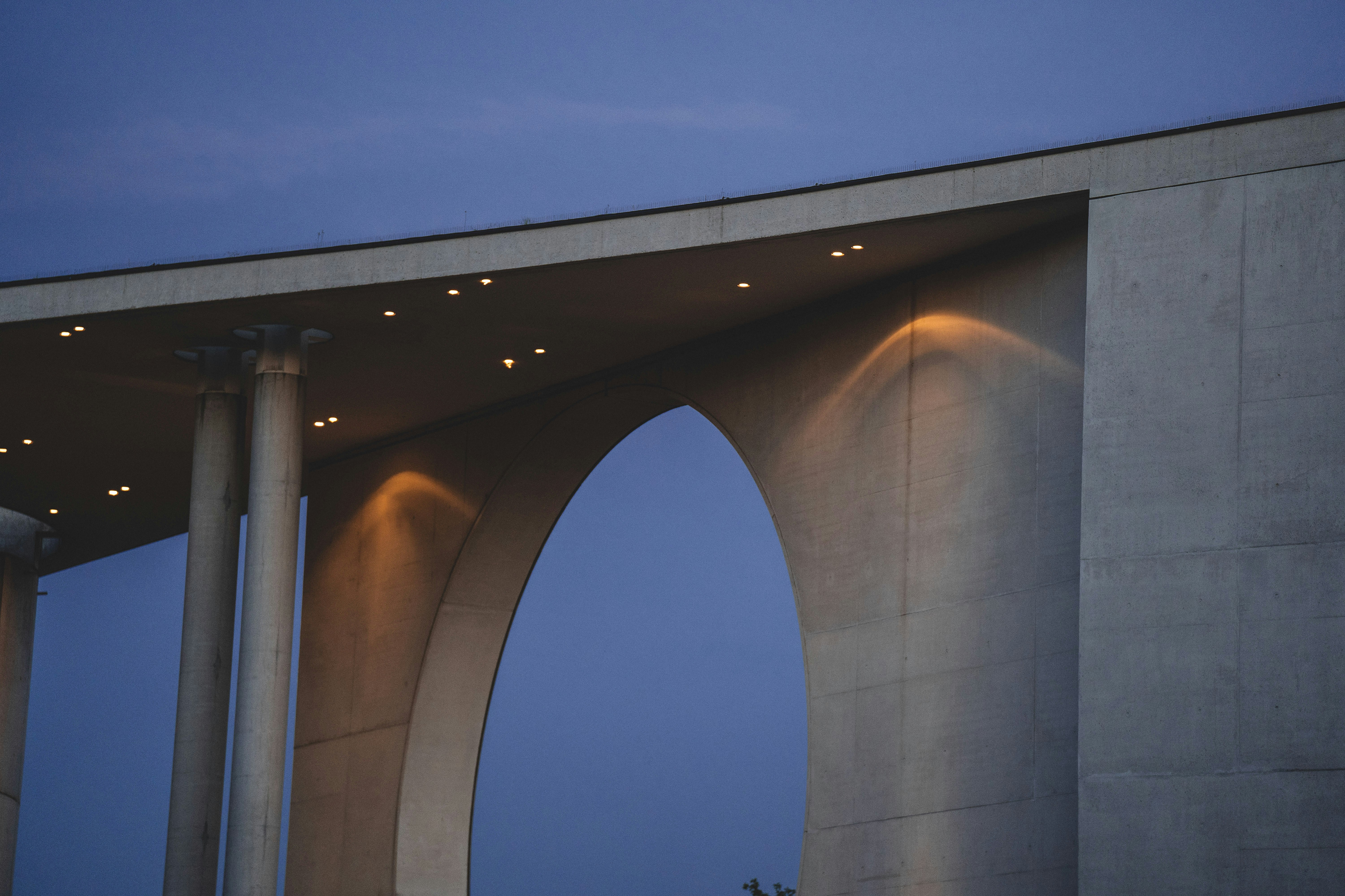 Arc of Silence: Concrete Arch Framed Under Evening Light
