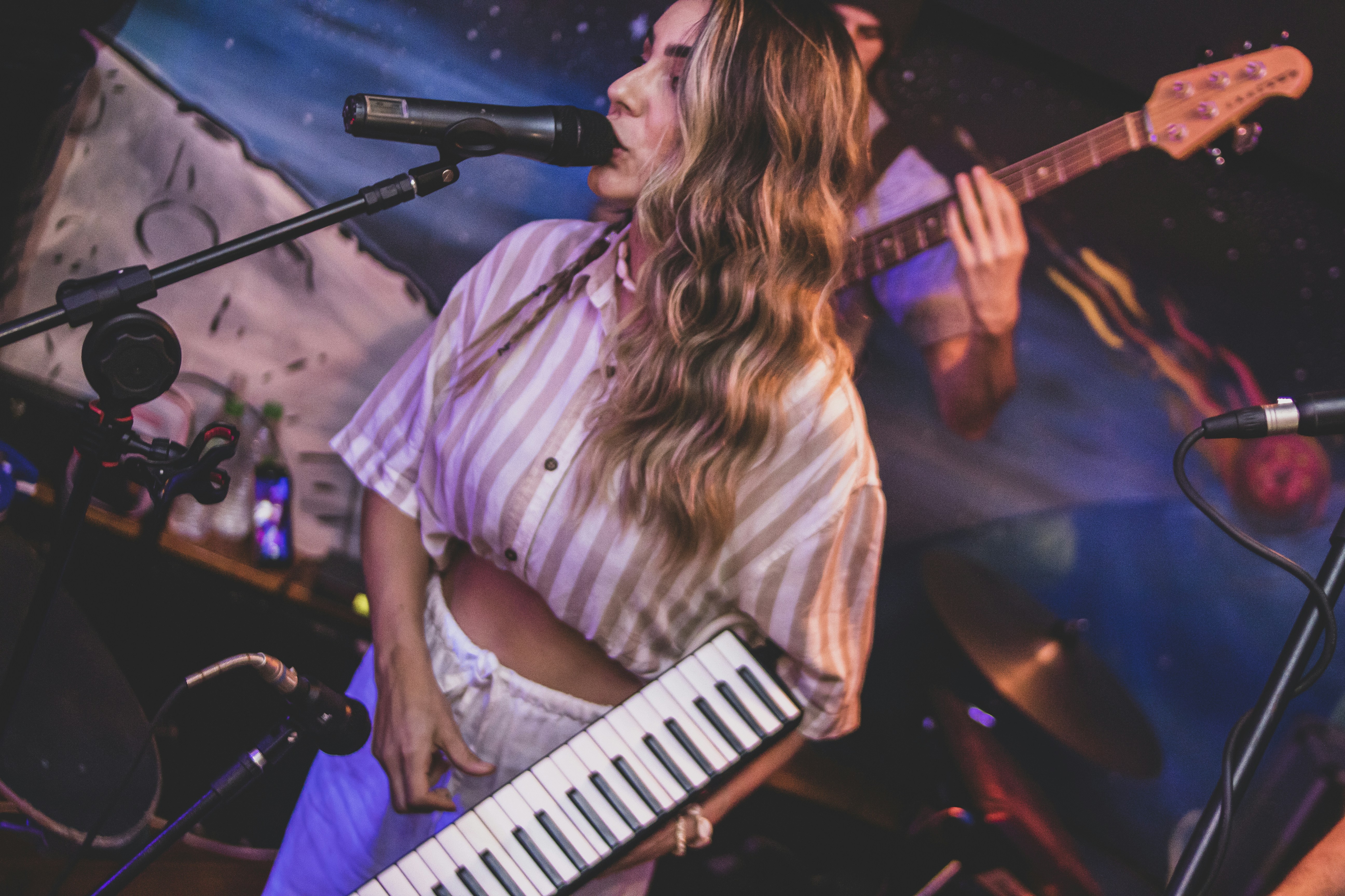Neon Spotlight Serenade: A Keytar-Driven Night Performance