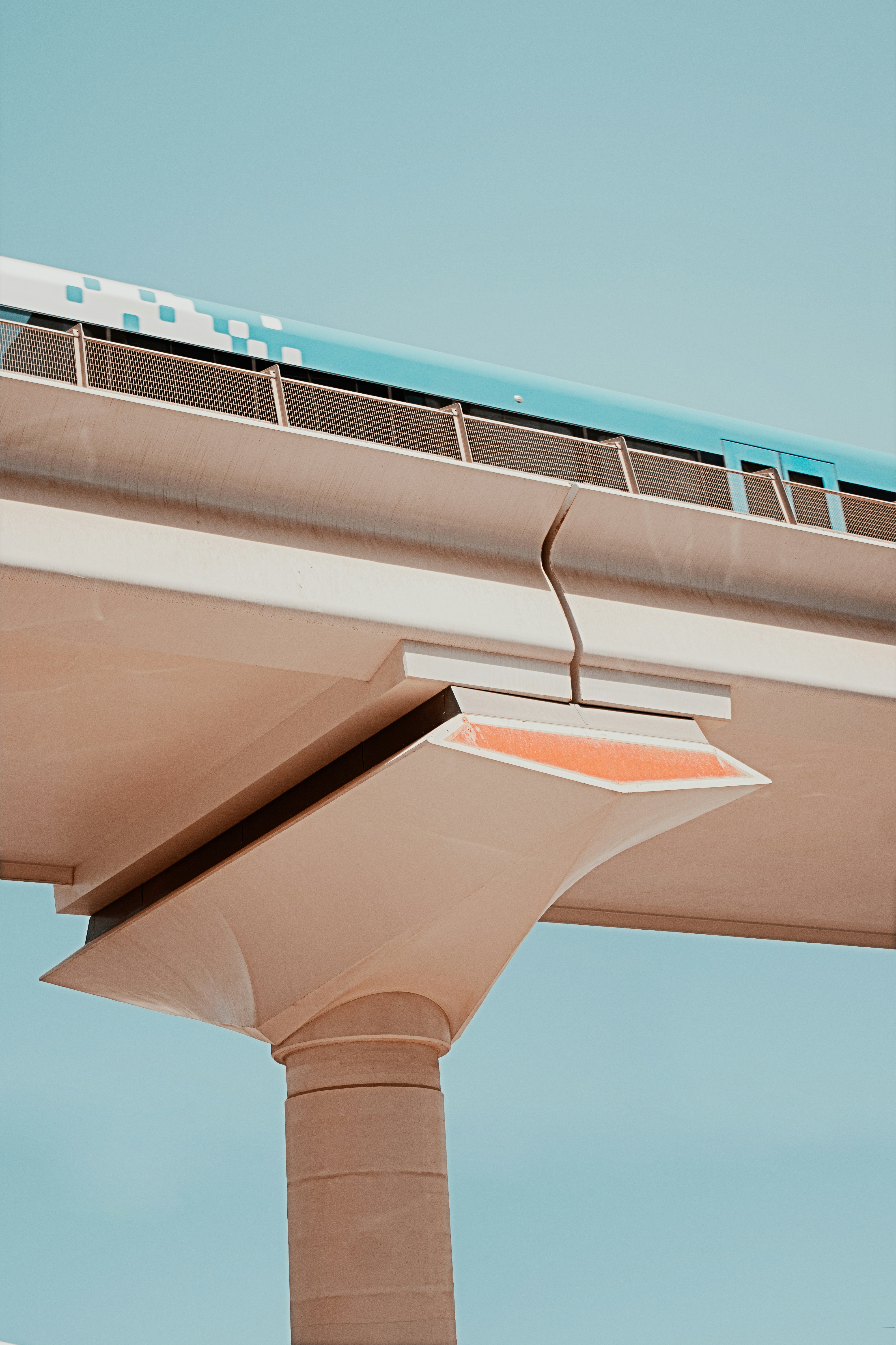 A blue and white train on top of a train track photo – Free Purple ...