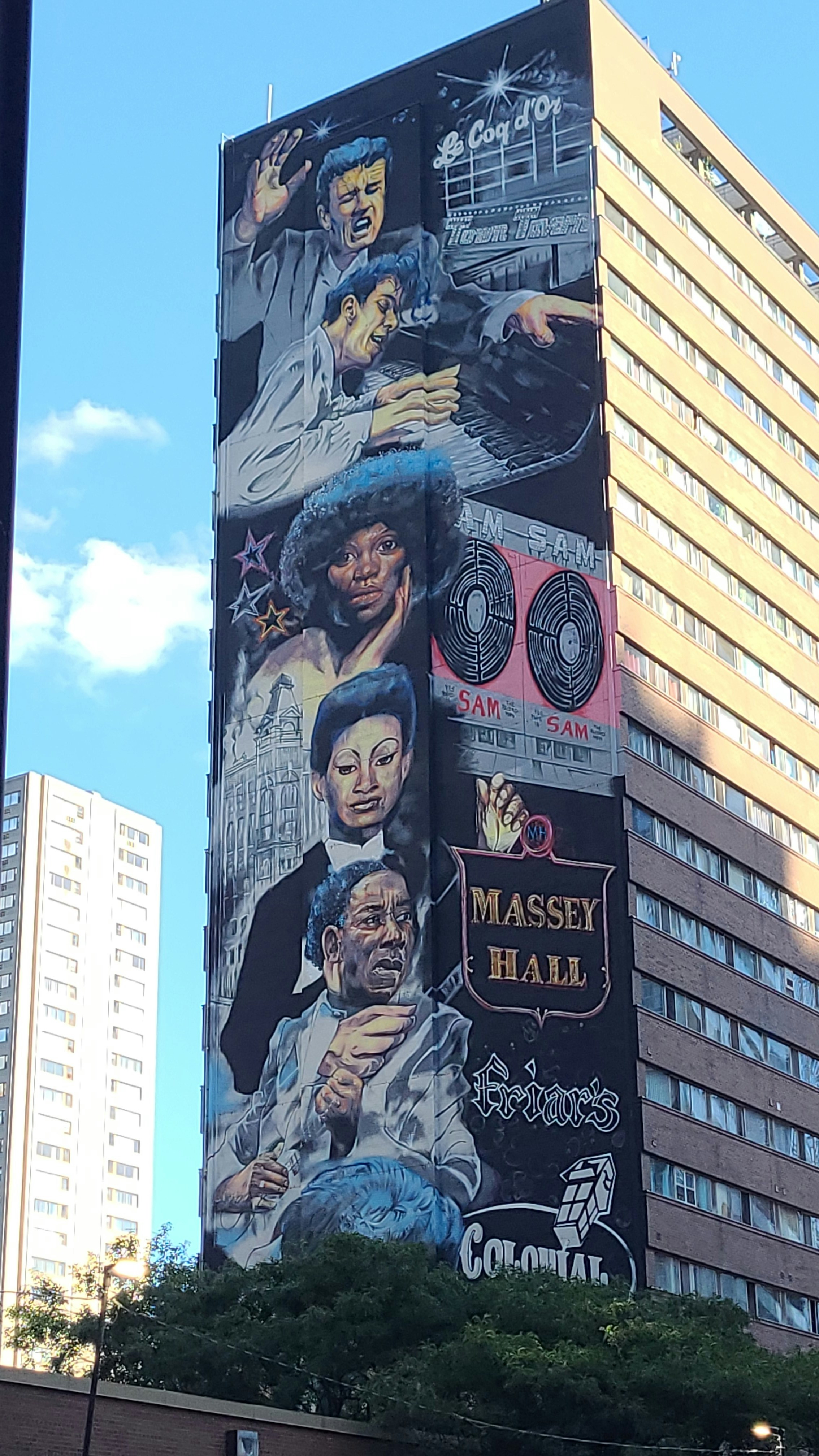 A tall building with a mural on the side of it photo – Free Mural Image ...