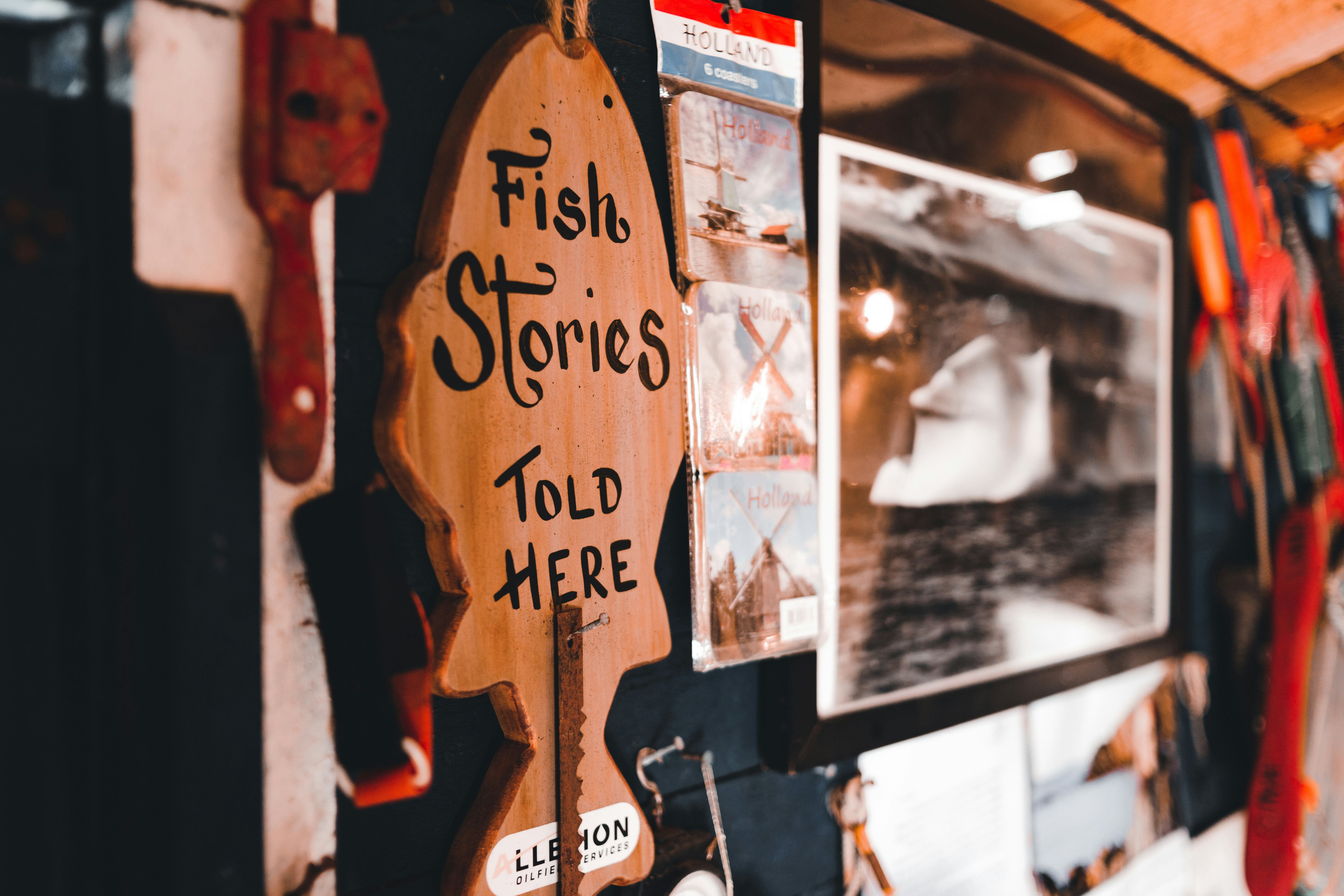 Fish Tales Told Here: A Weathered Sign Anchoring a Cozy Coastal Shop