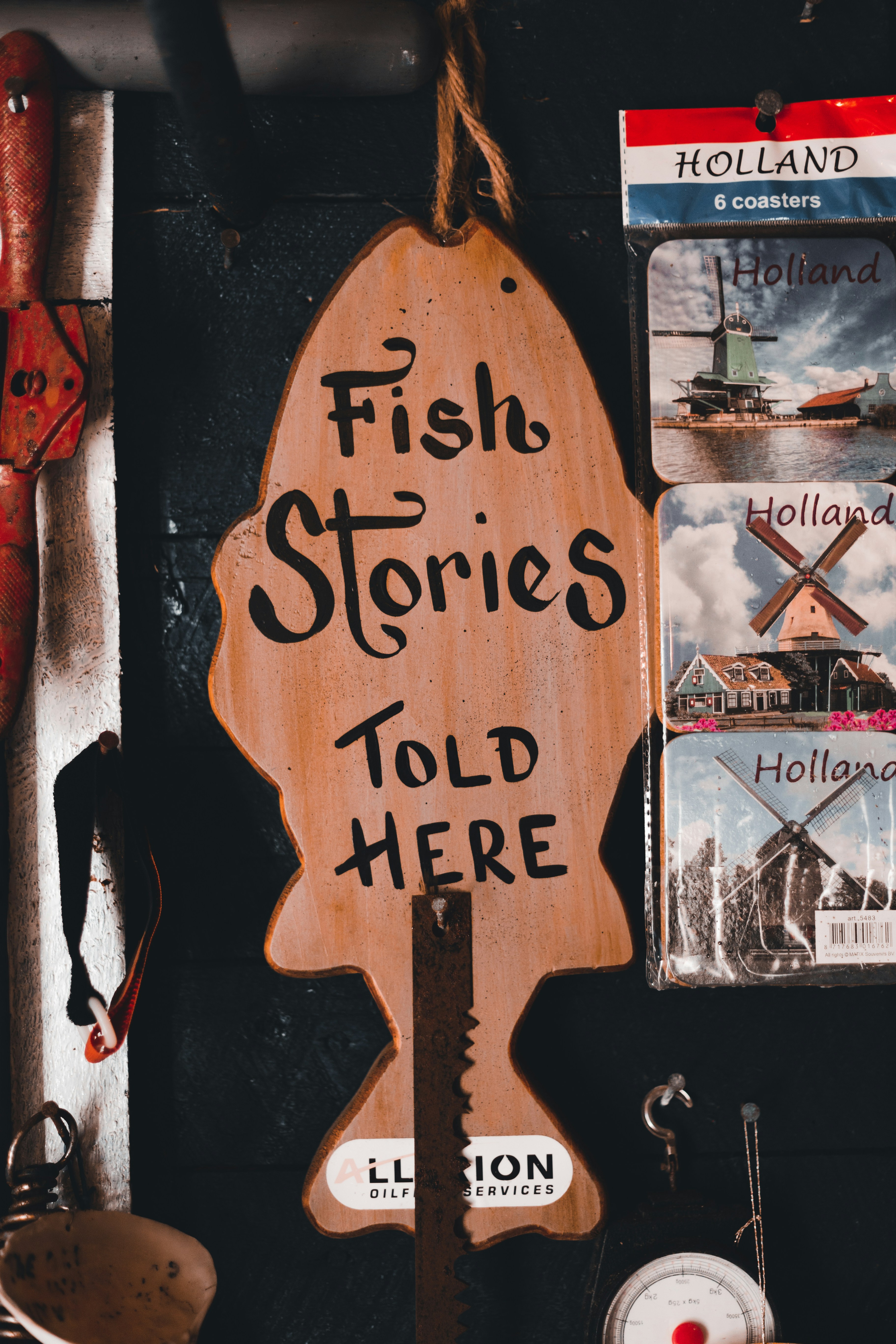 Fish Stories Told Here: A Hand-Carved Sign Anchored in a Nautical Nook
