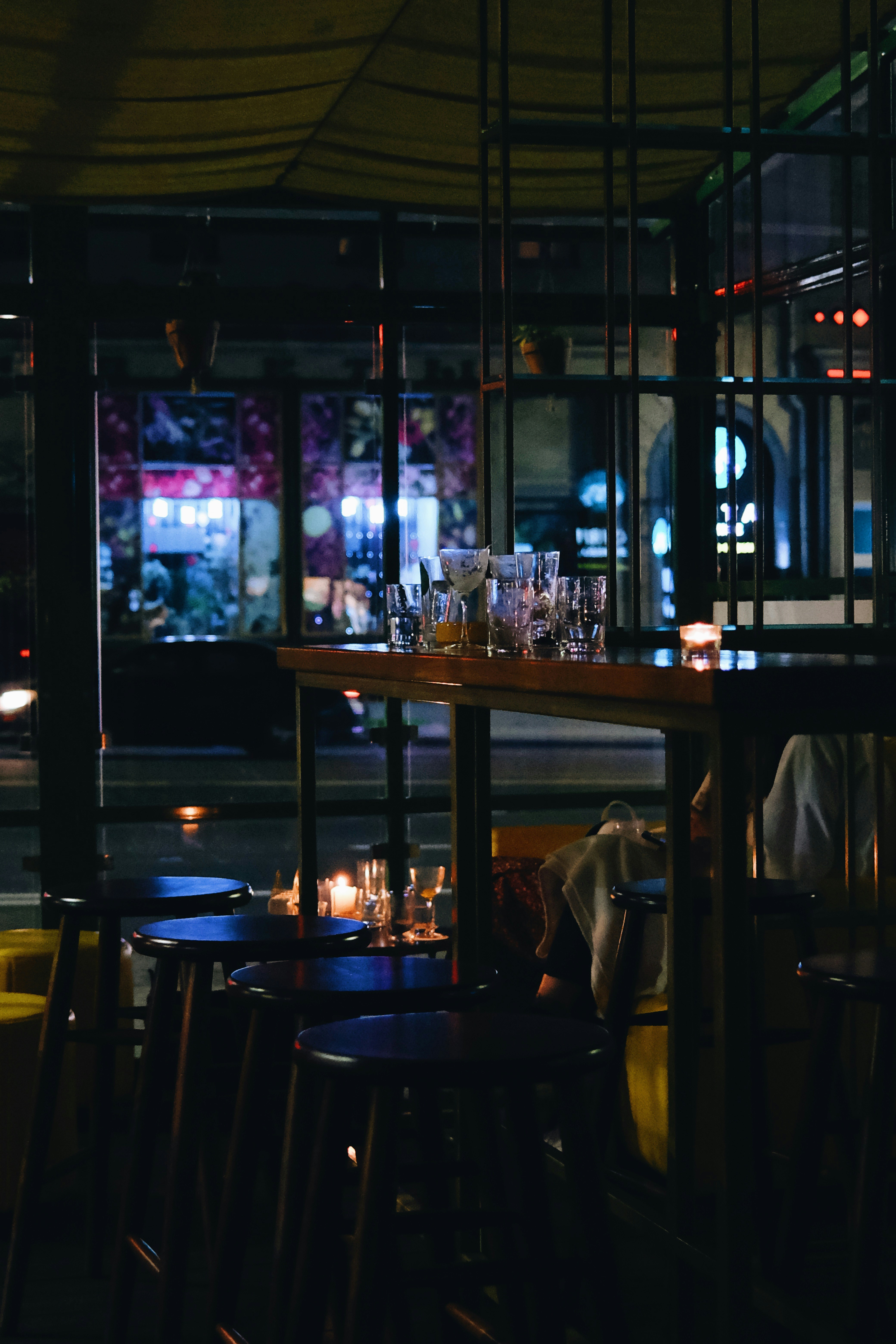 A dimly lit restaurant with tables and chairs photo – Free Minsk Image ...