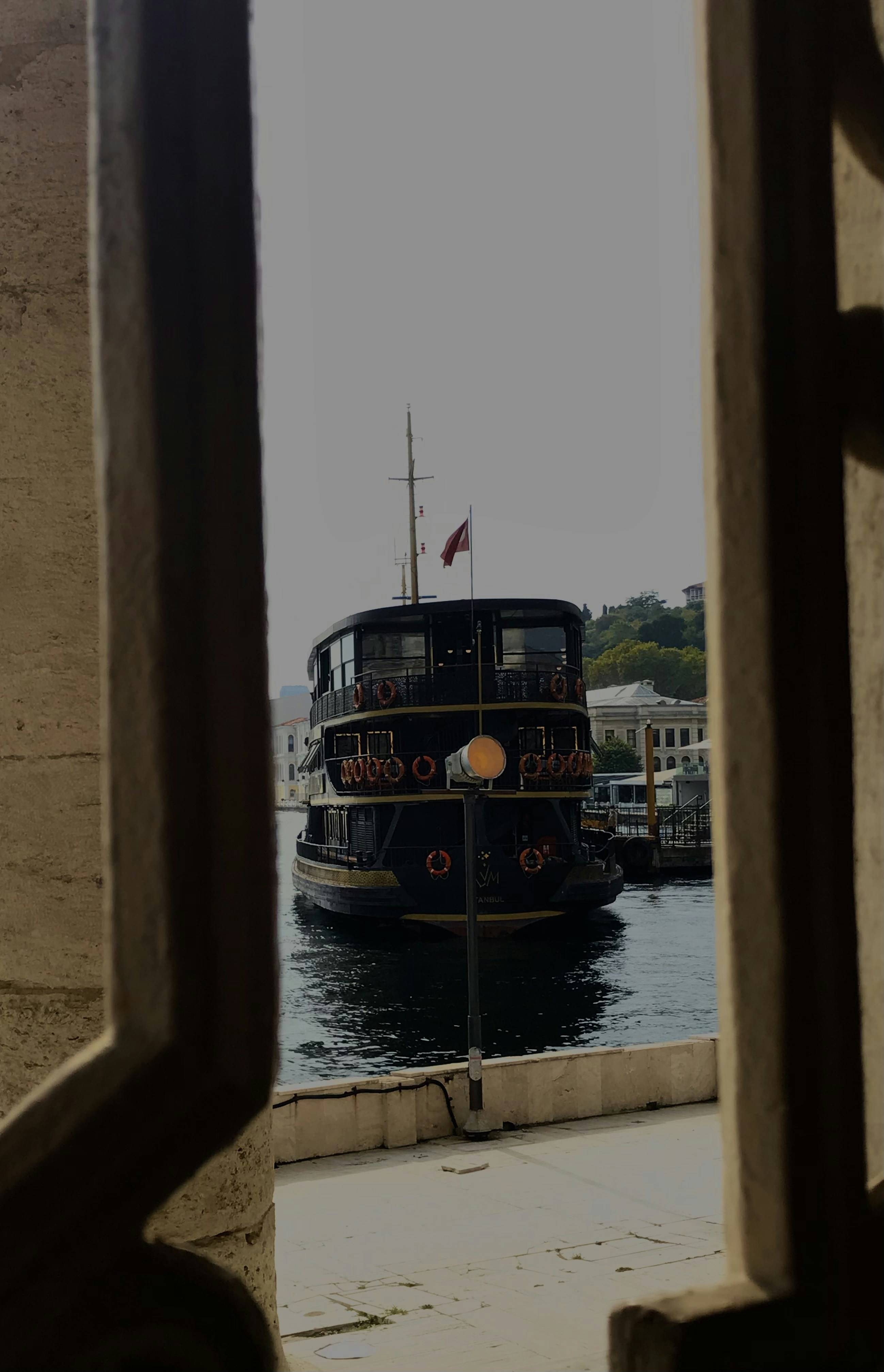 Through Stone Arches to a Harbor Steamer