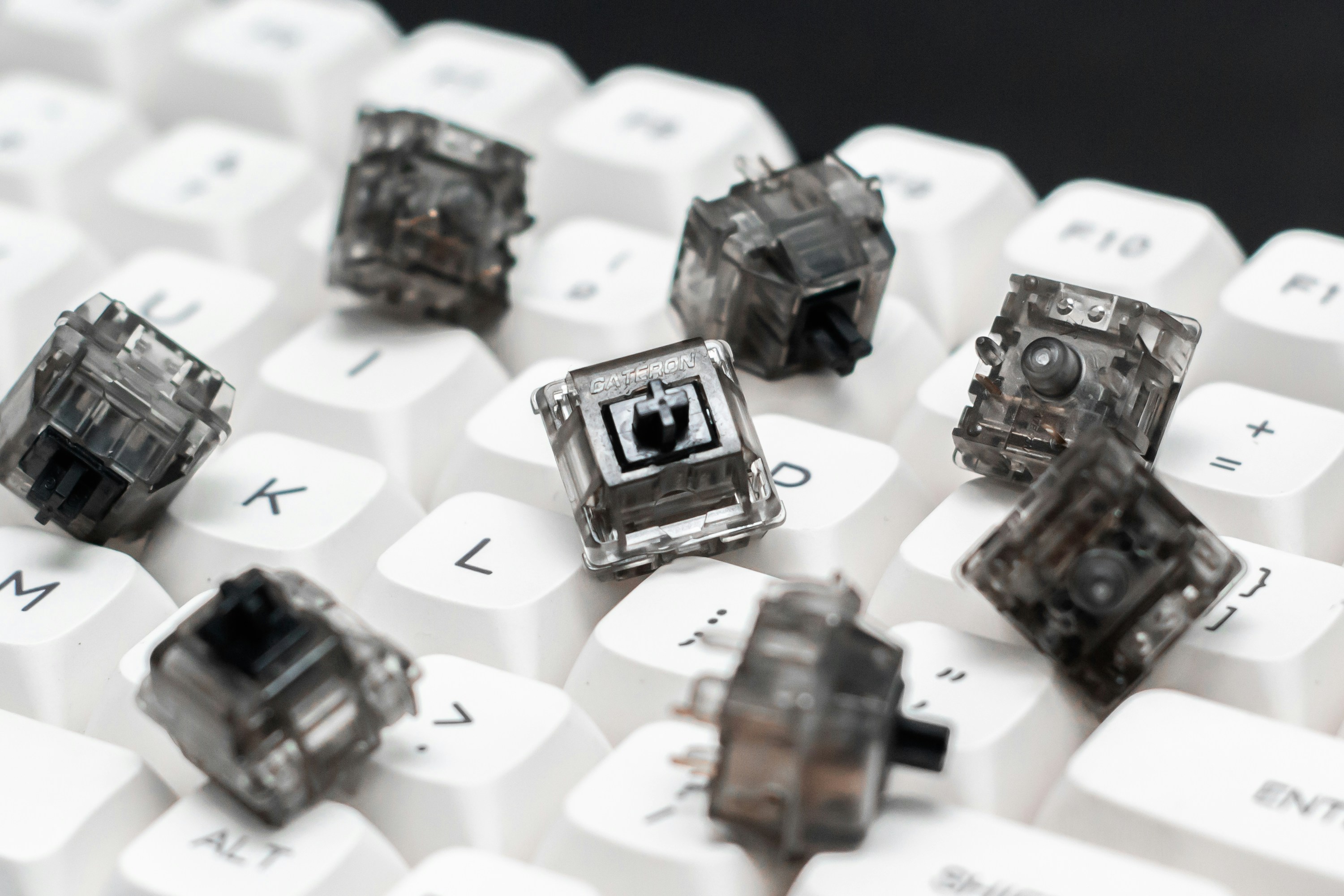 A close up of a keyboard with a bunch of small objects on it photo ...