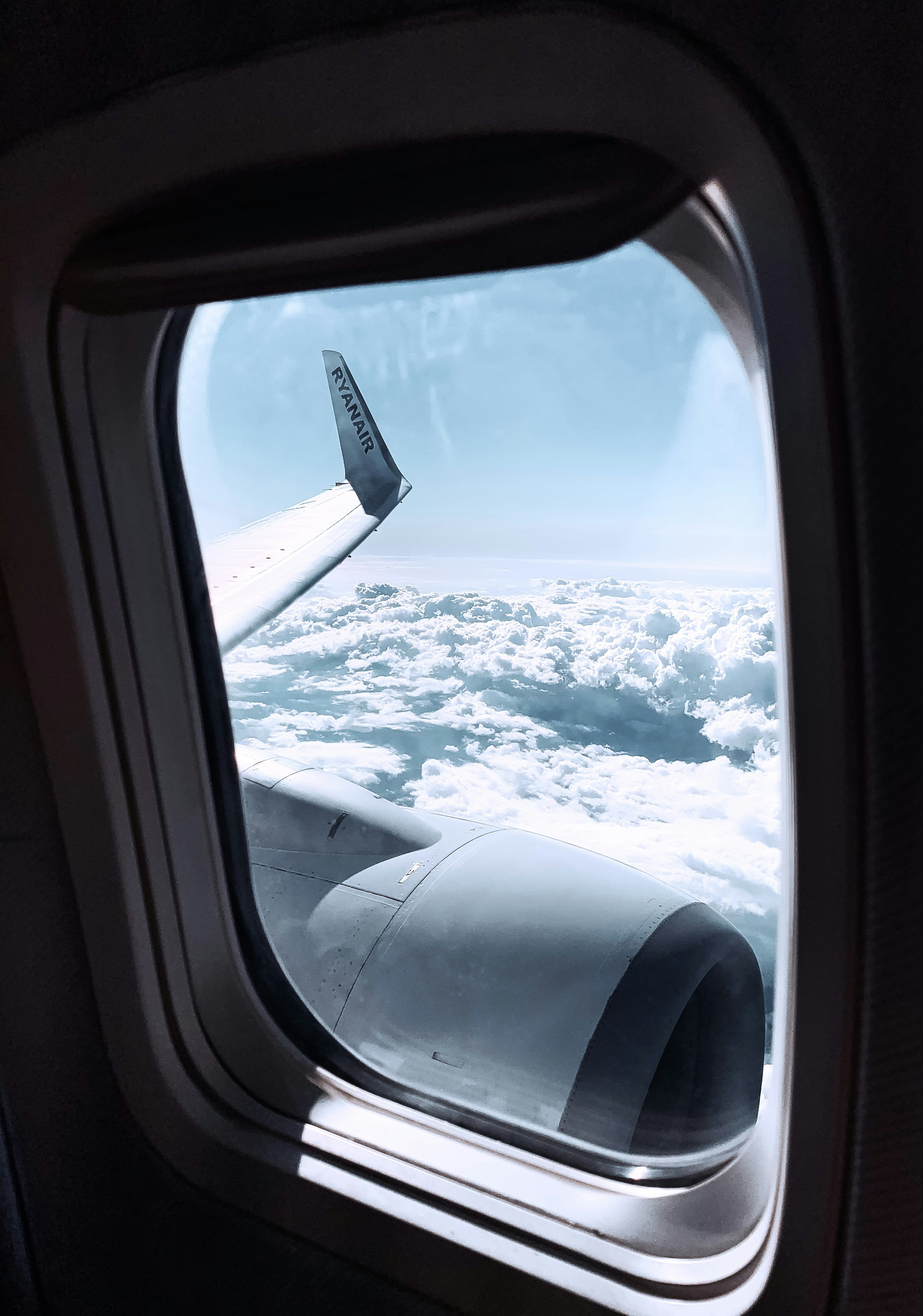 A view of the wing of an airplane through a window photo – Free ...