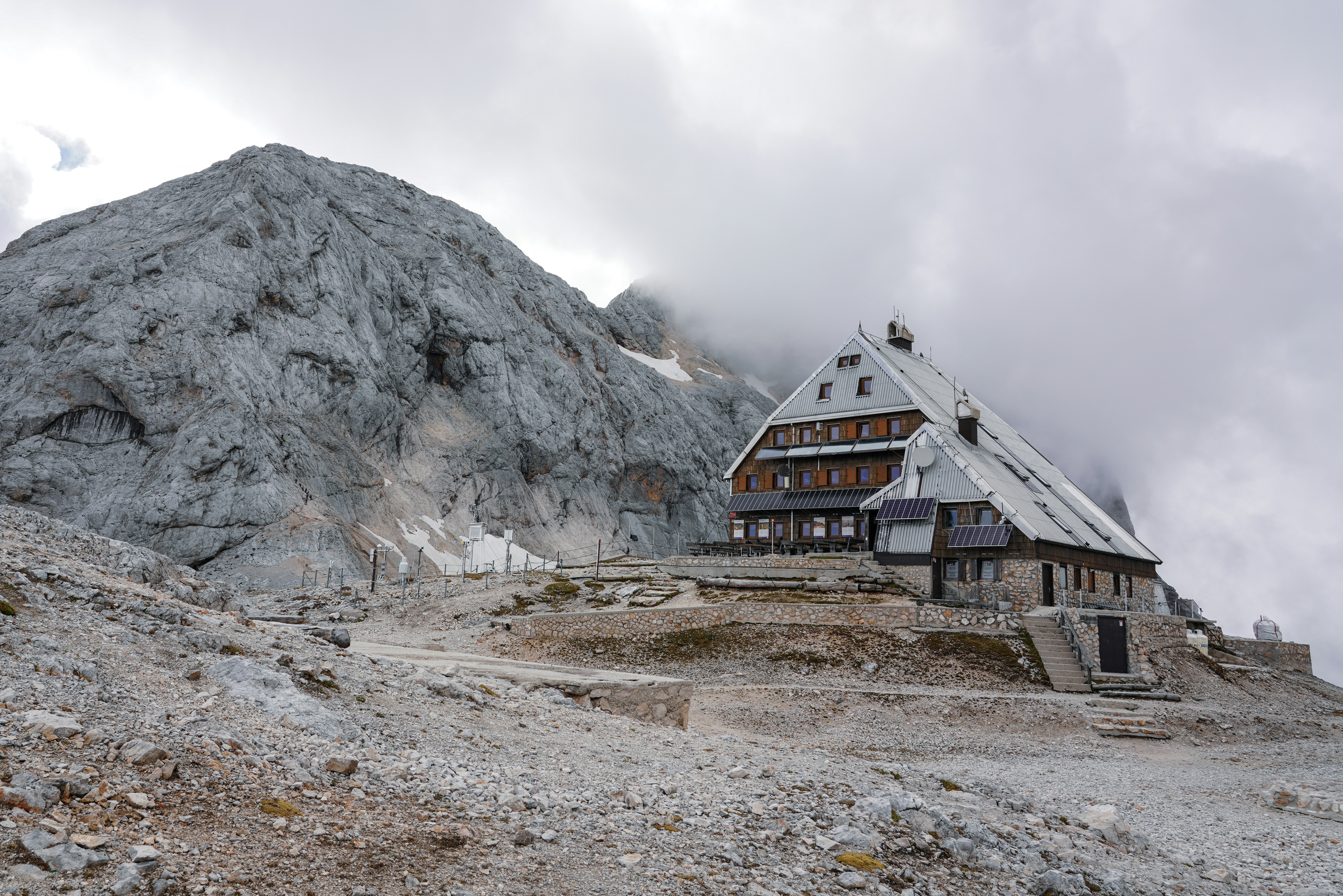 a mountain with a house on top of it