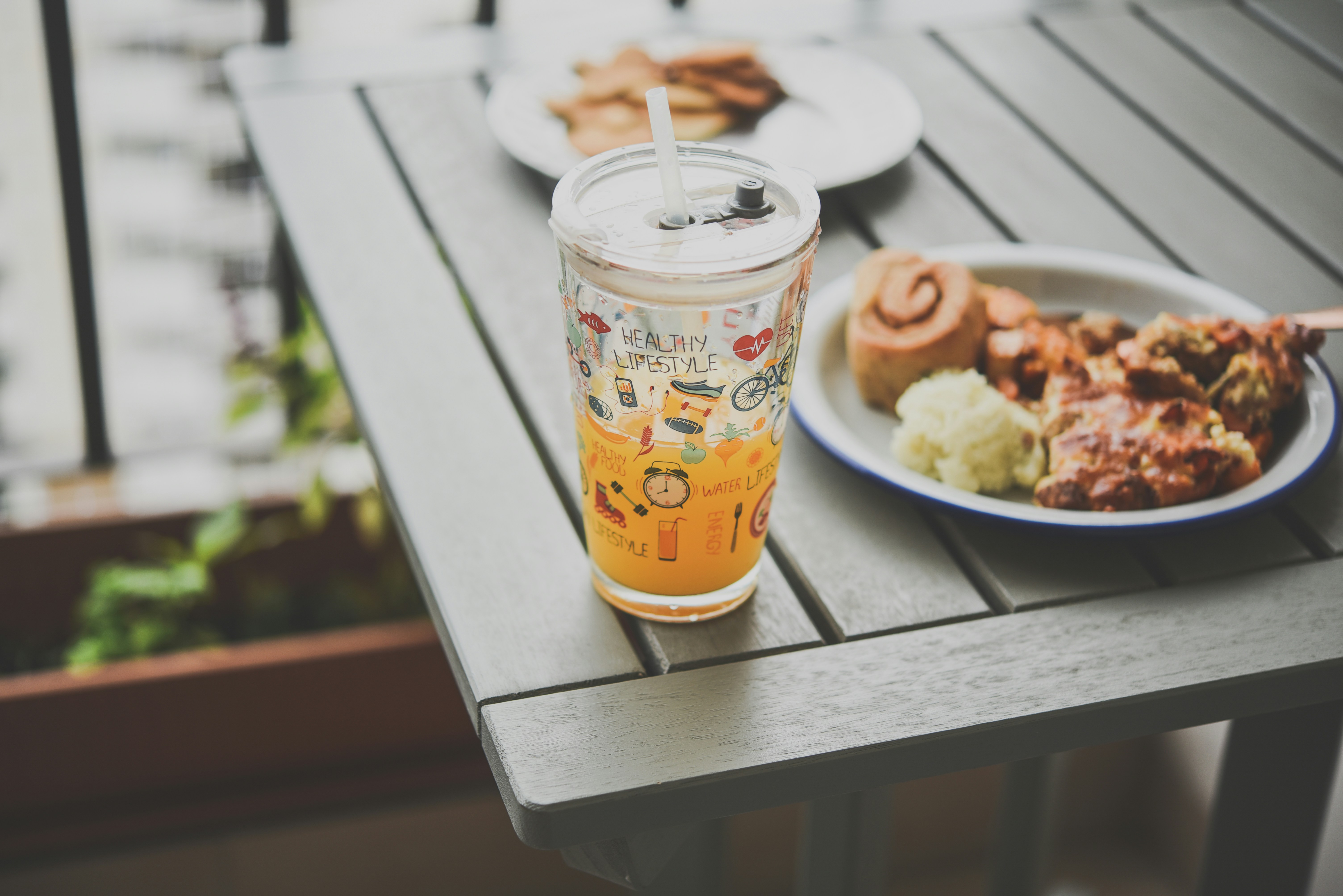 a plate of food and a drink on a table