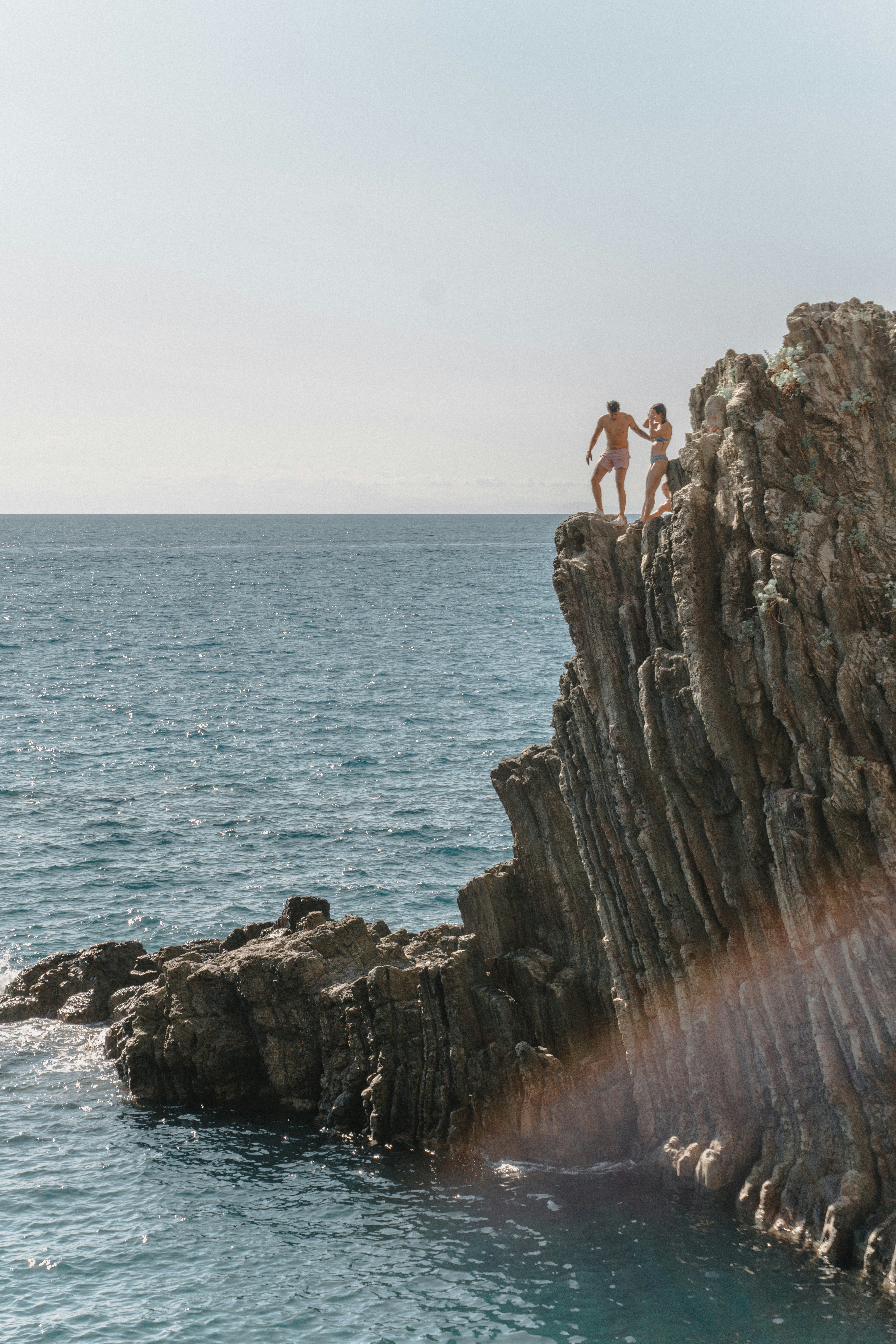 Edge of the Atlantic: two figures on a jagged cliff