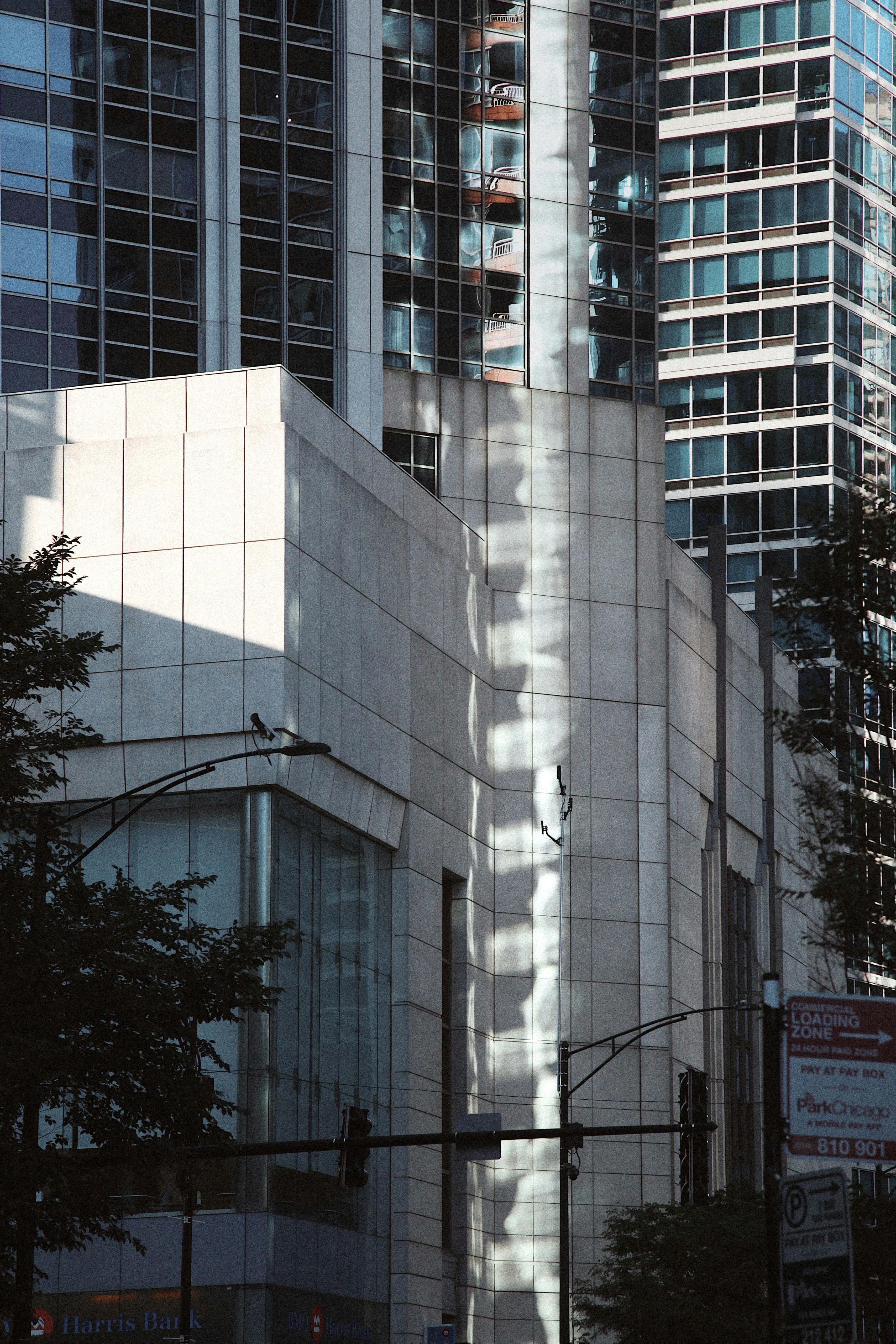 A tall building with a ladder on the side of it photo – Free Chicago ...
