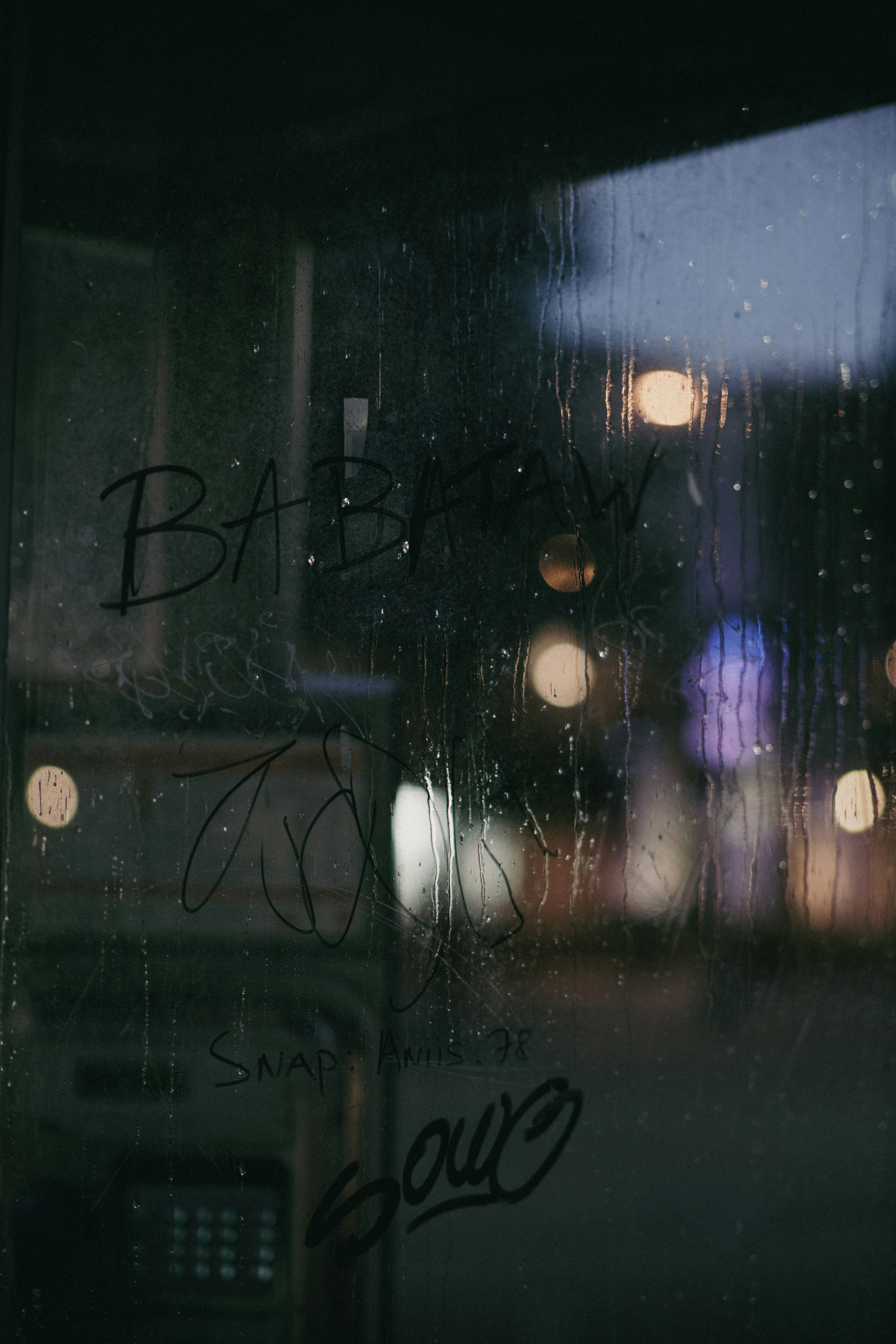 Neon Night Through a Graffiti-Soaked Window
