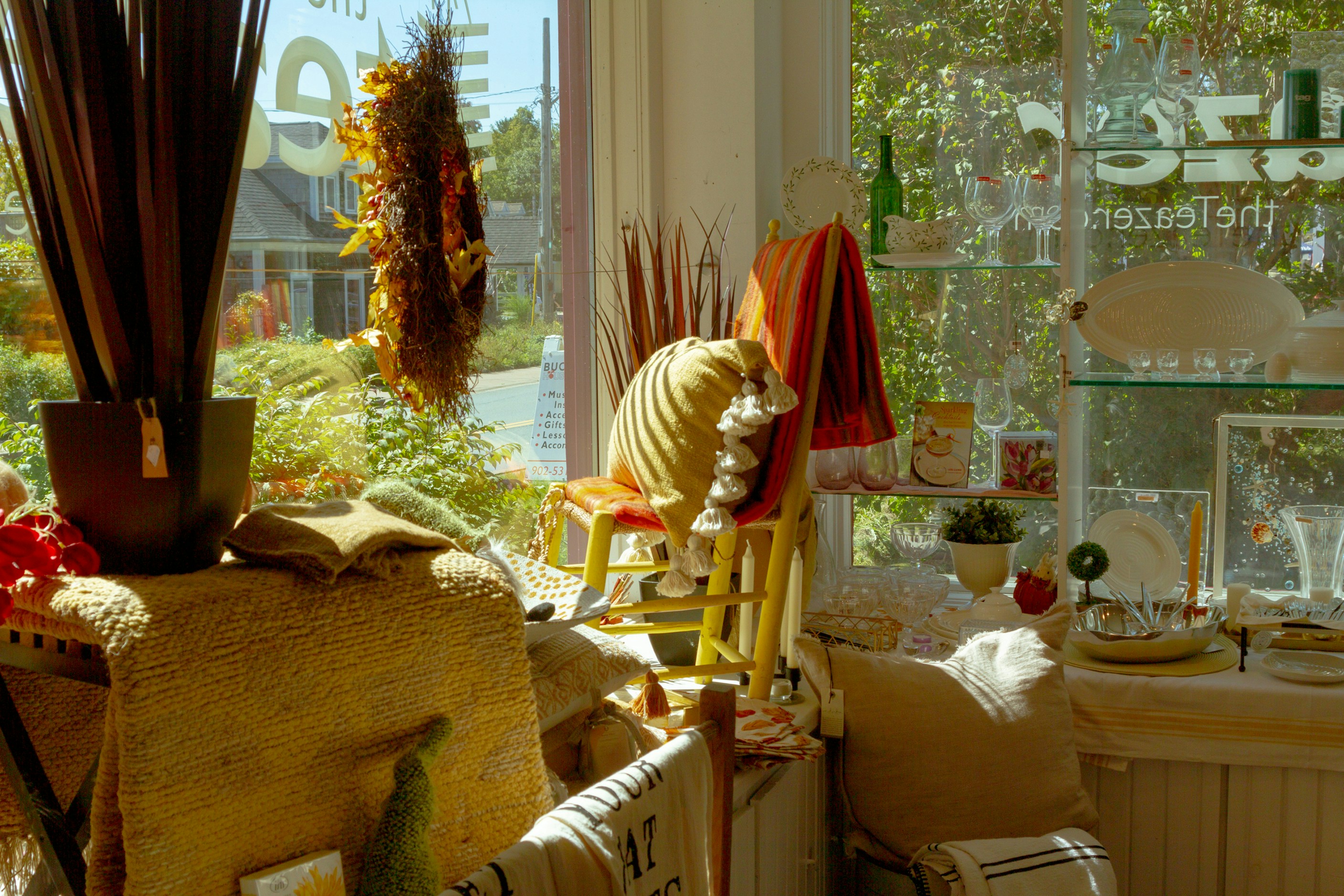 Sunlit Cozy Shop with Autumnal Decor and Textiles