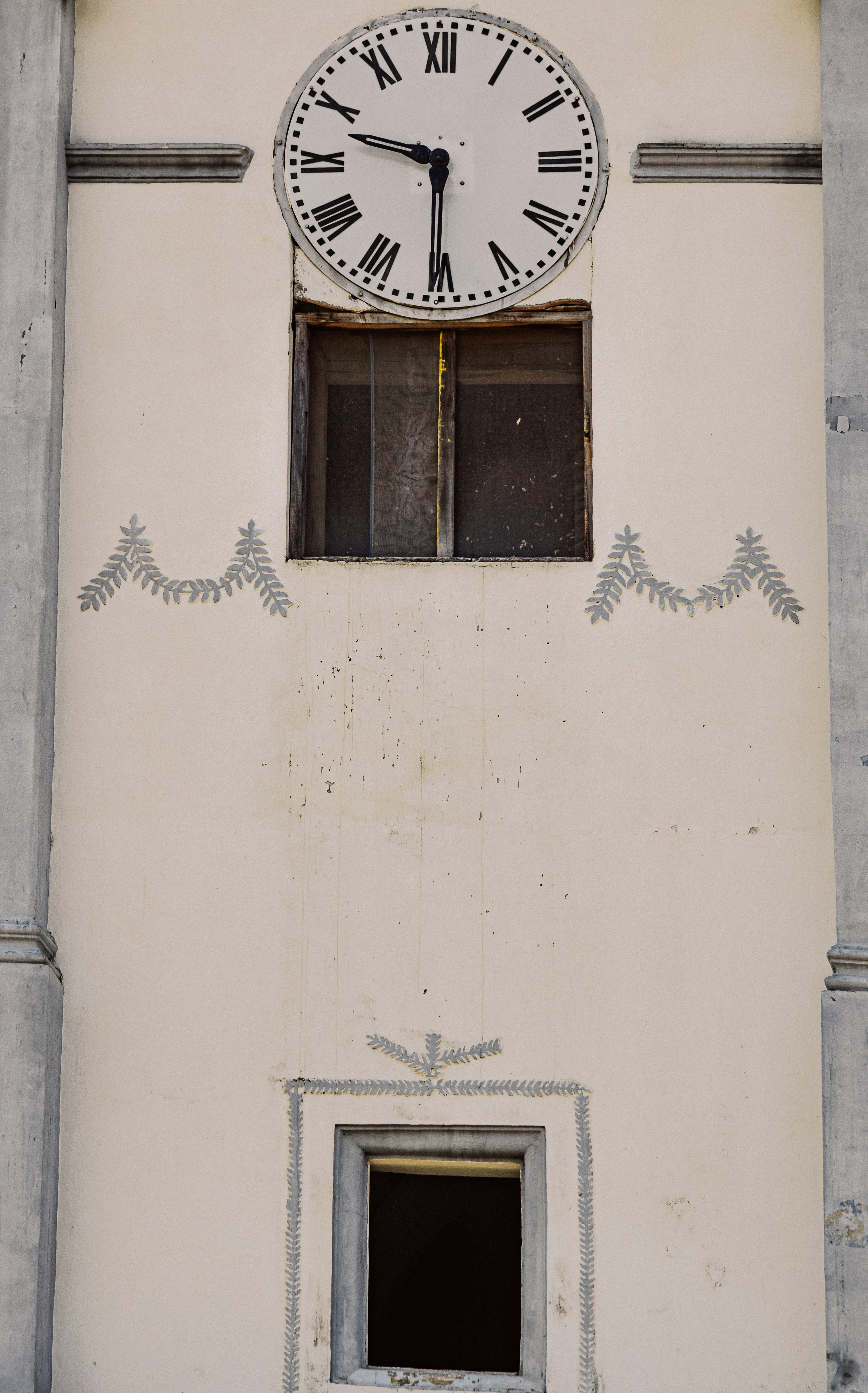 a large clock mounted to the side of a building