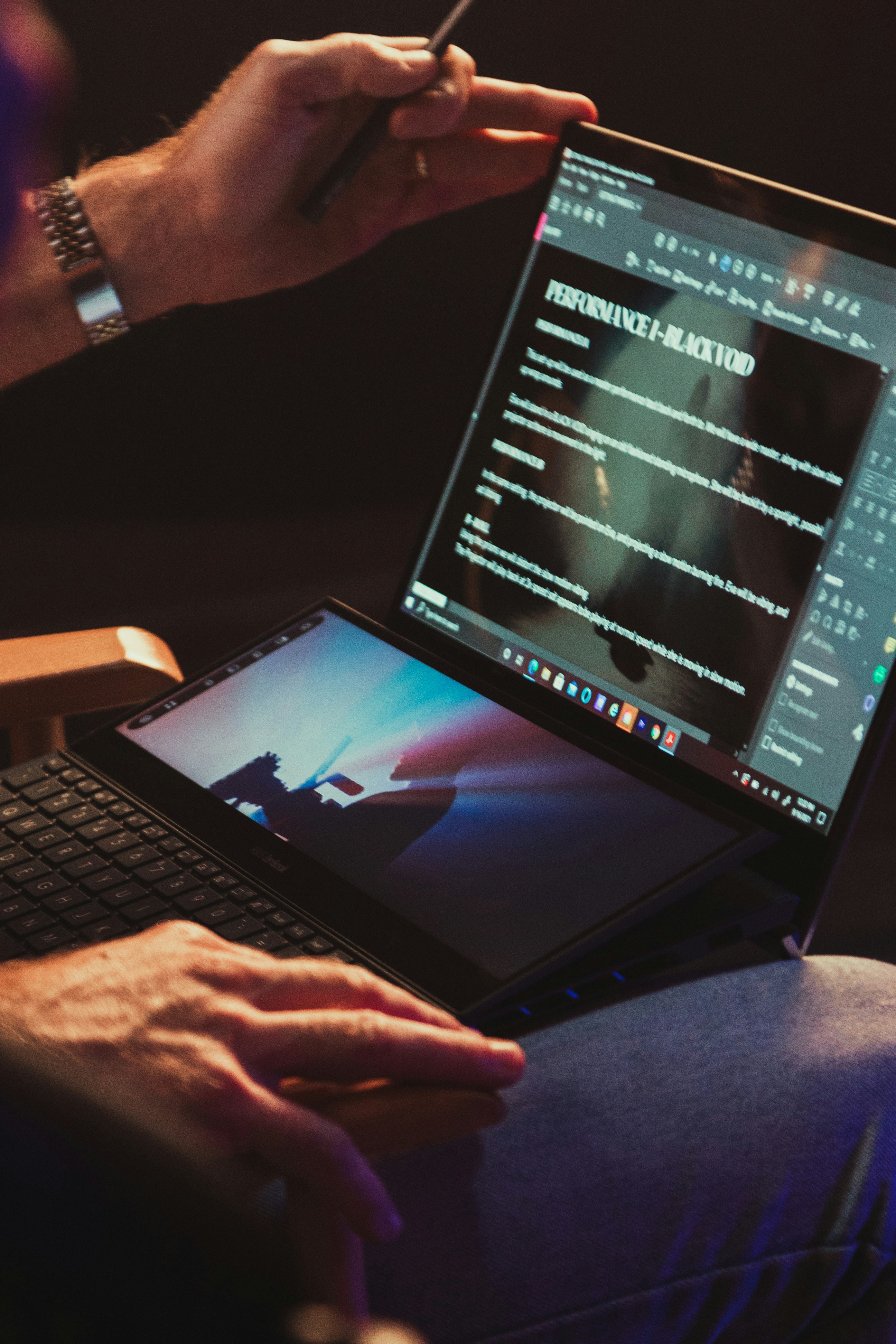 A person sitting in a chair with a laptop on their lap photo – Free ...