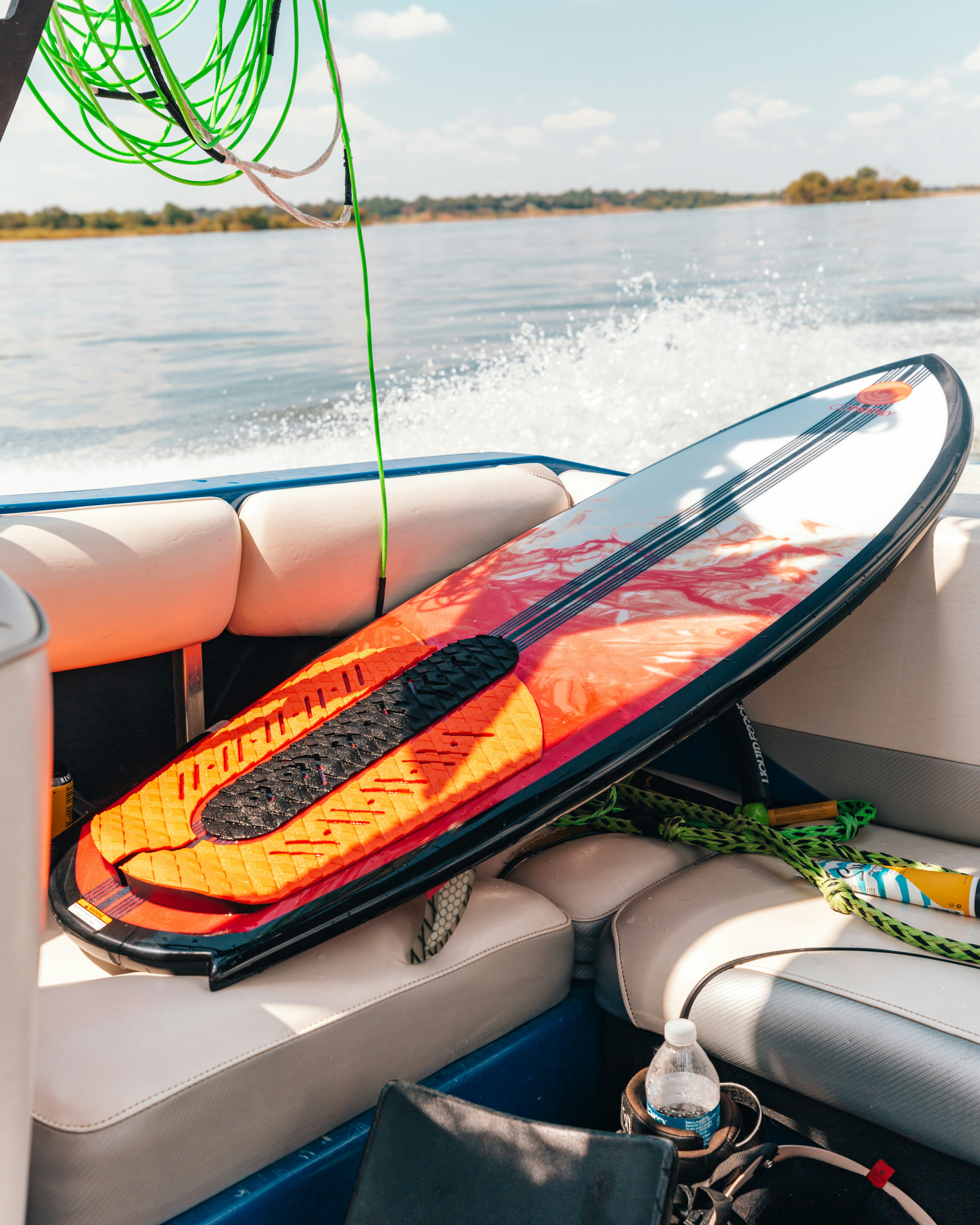 a surfboard is strapped to the back of a boat