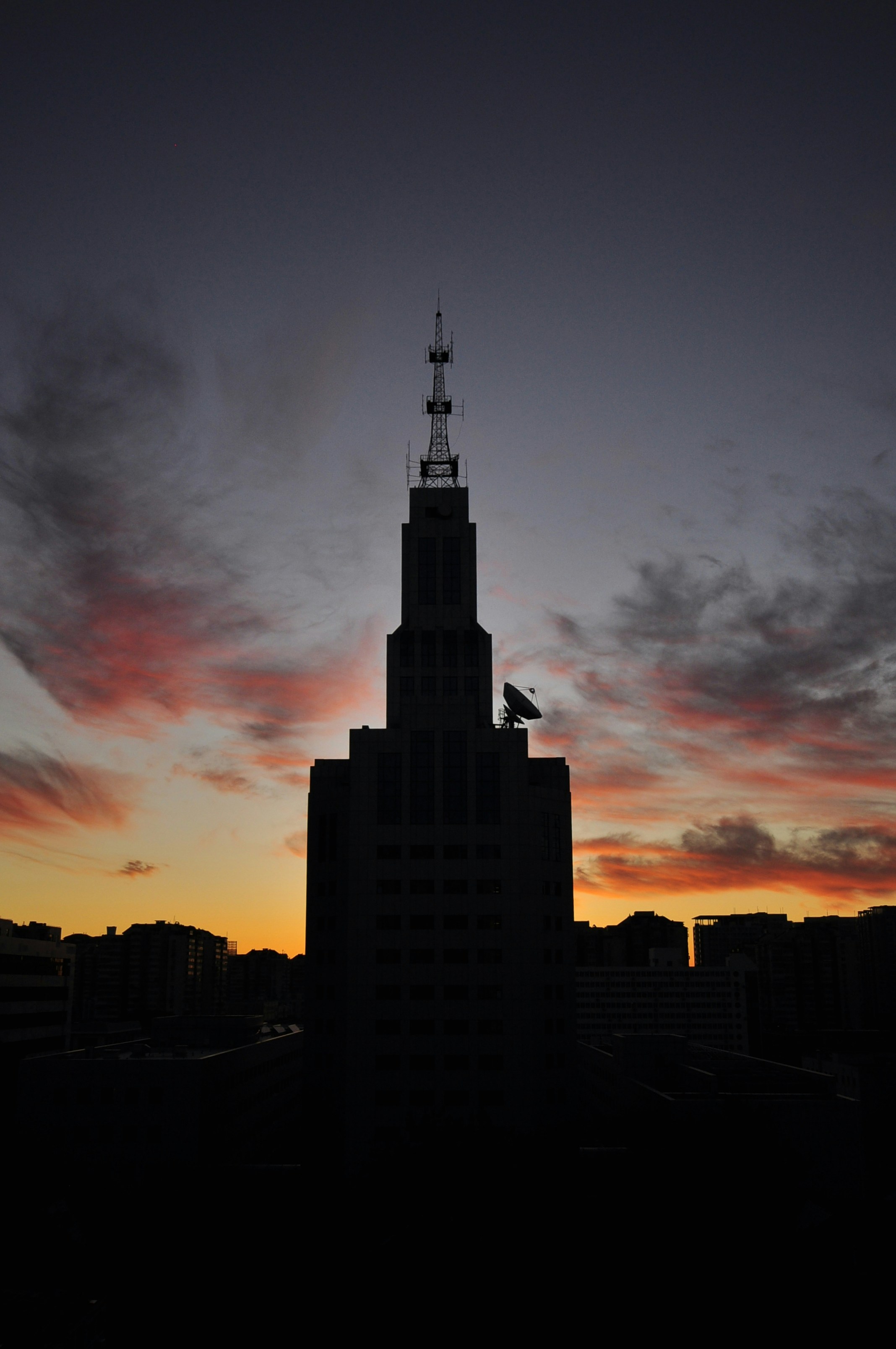 Silhouette Spire at Dusk: A City Summit Under a Gradient Sky