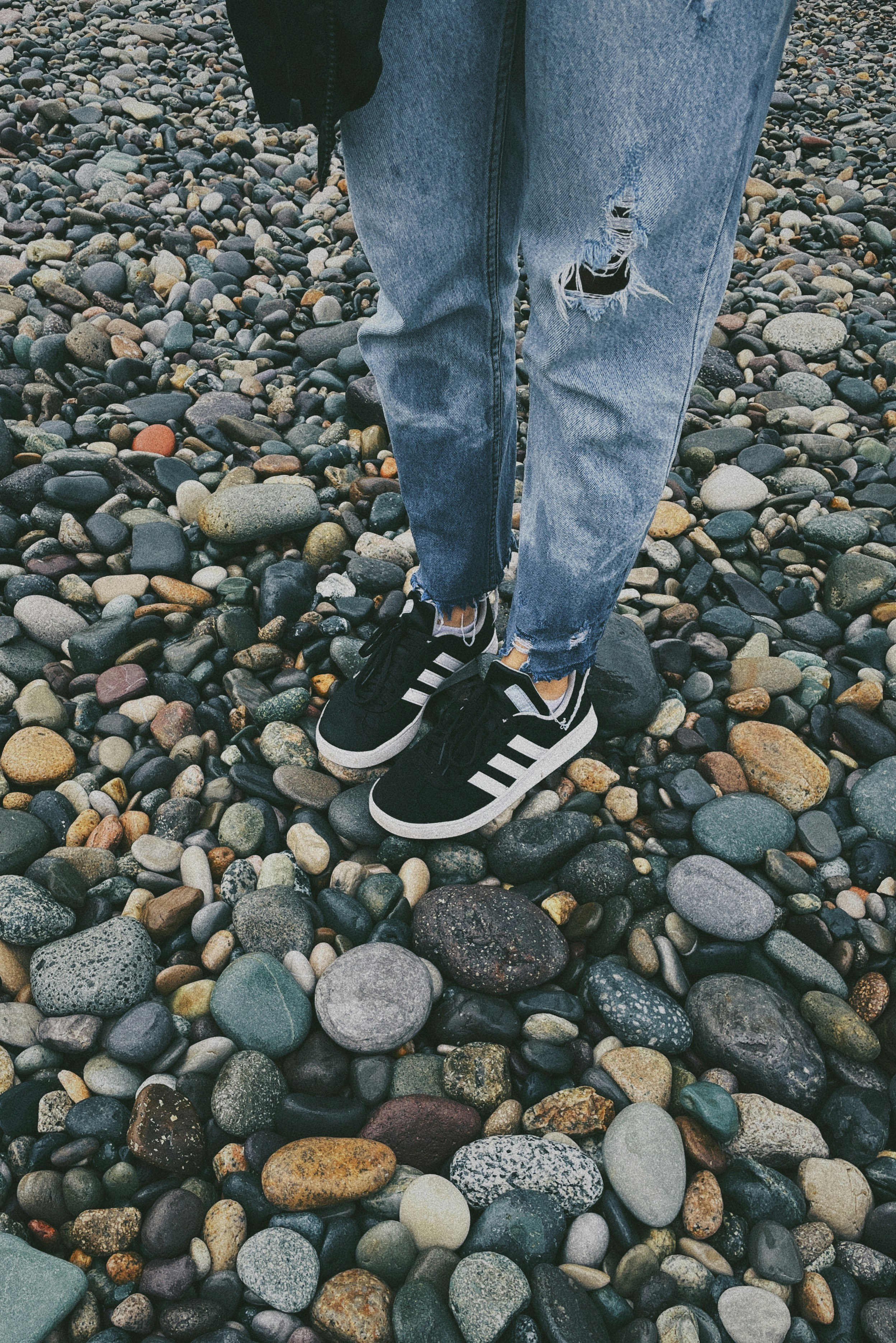 a person standing on top of a pile of rocks