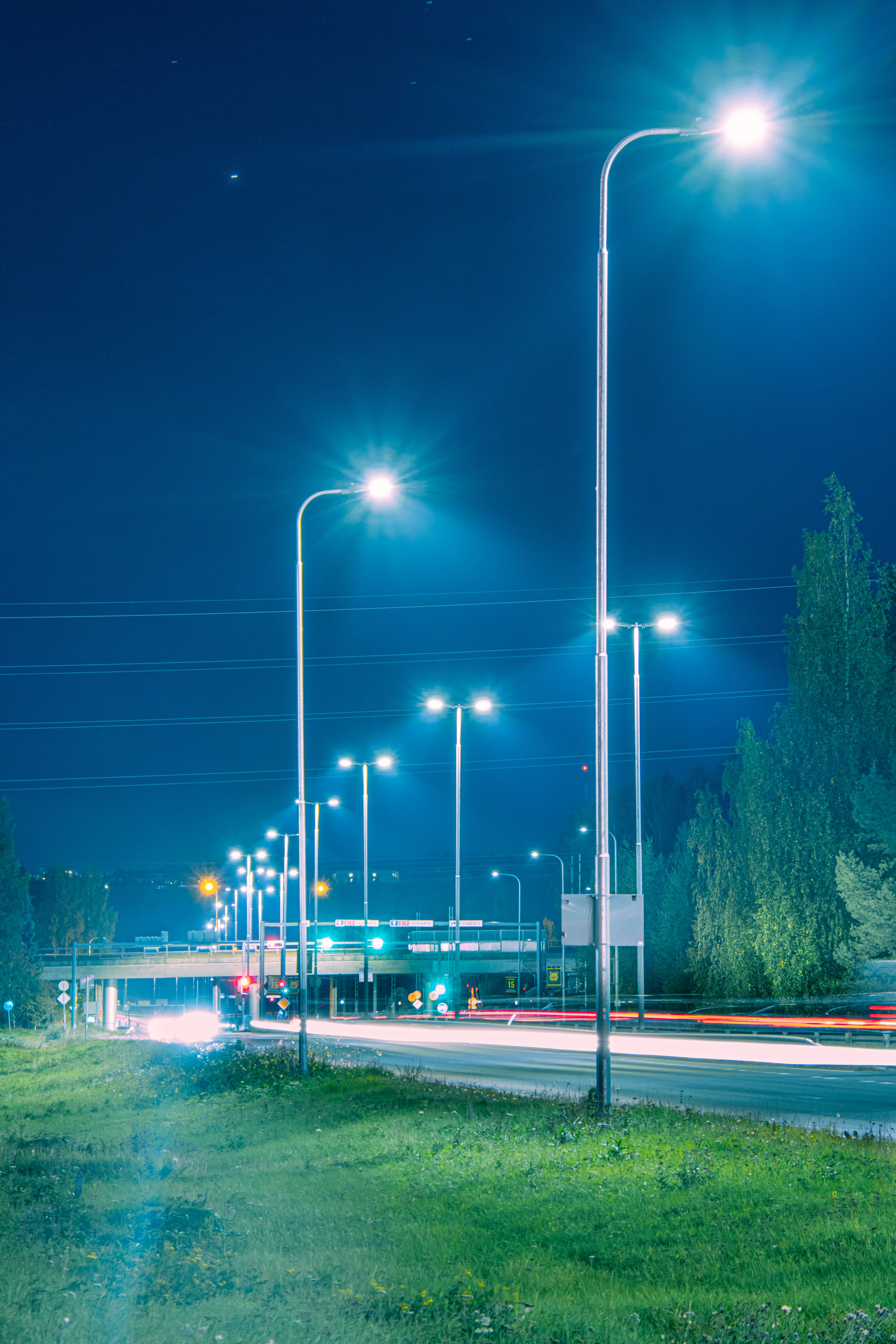 A city street at night with street lights photo – Free Hervannan ...