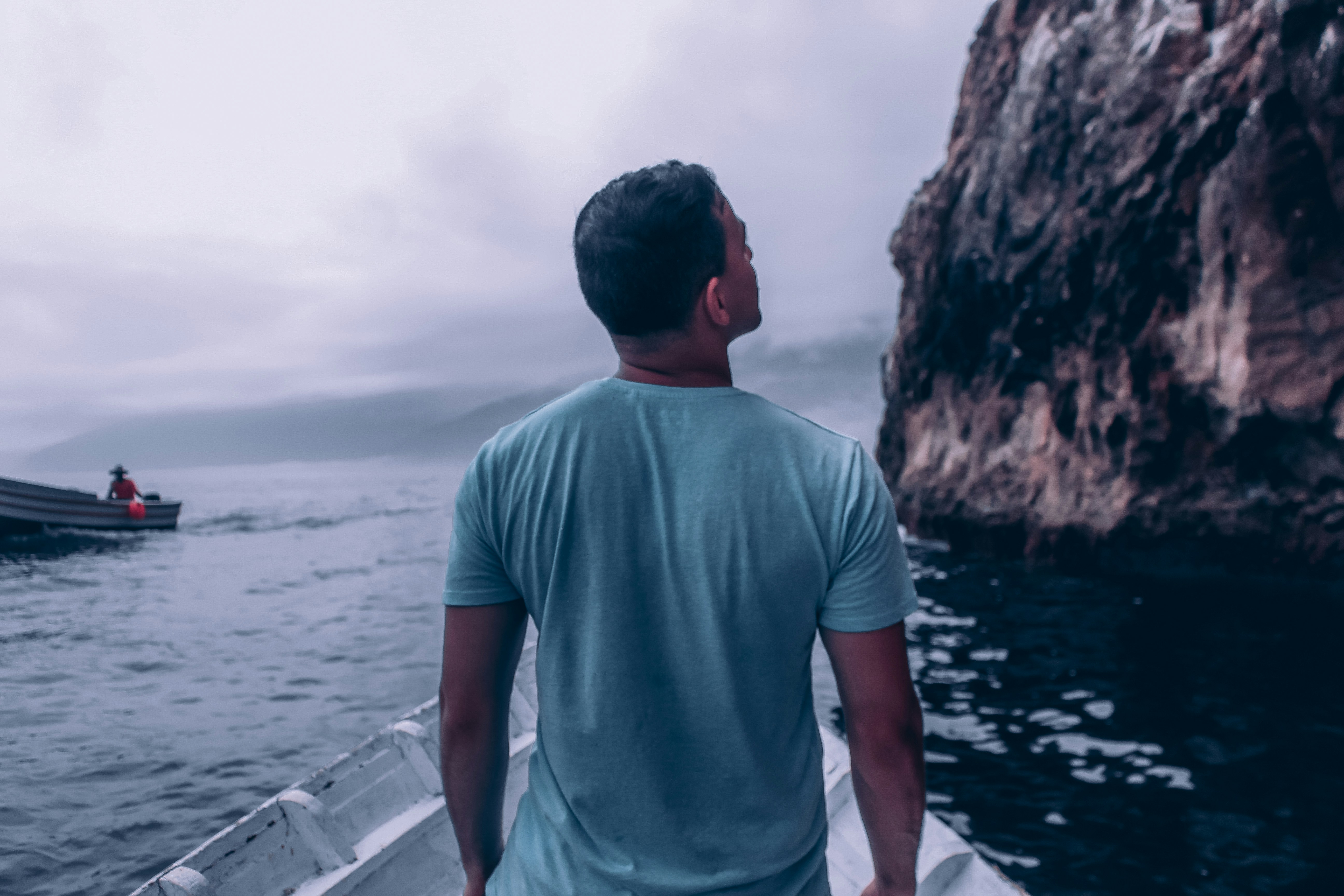 Back to the Sea: A Man Faces the Cliffs from a Small Boat