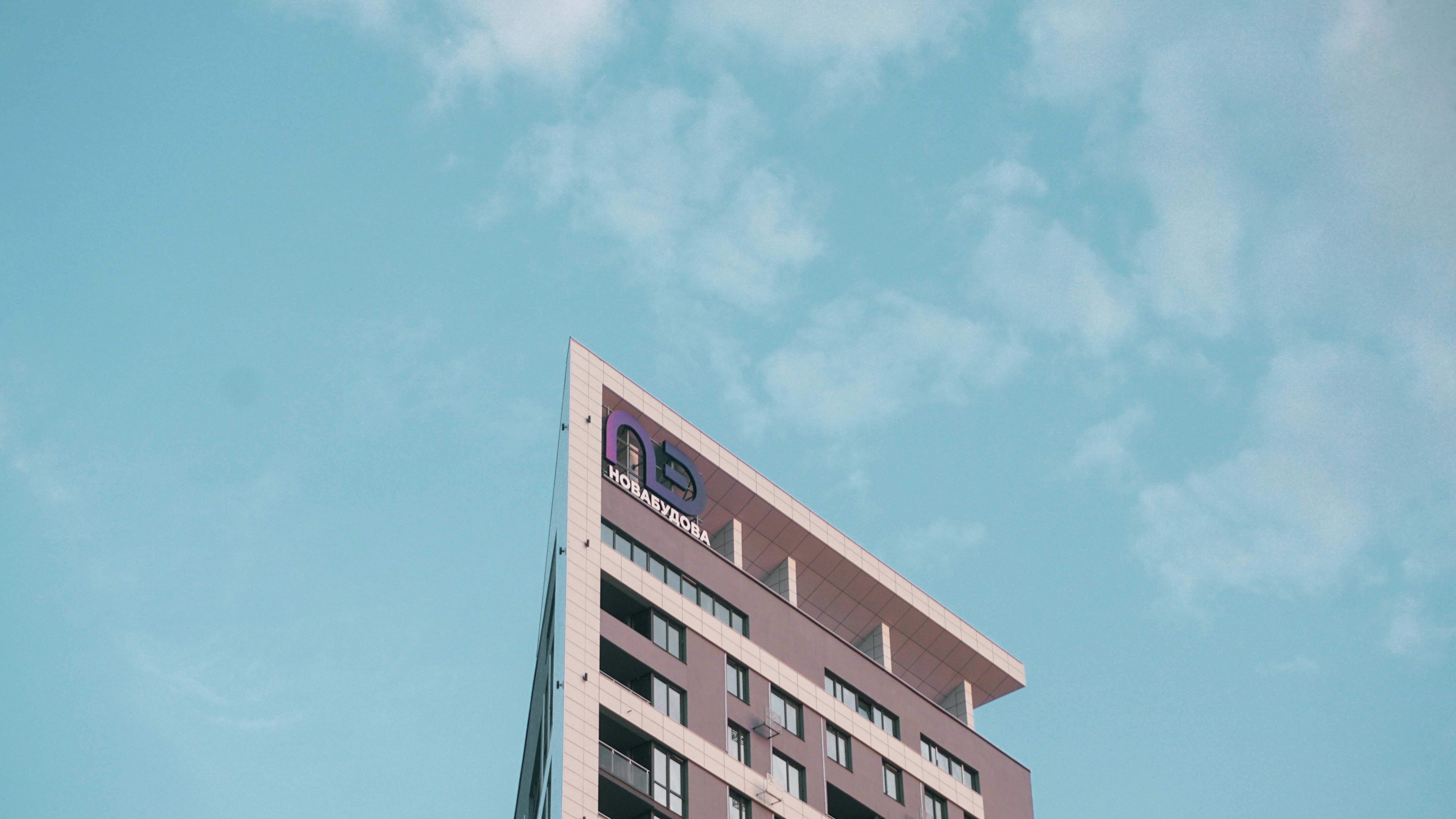 a tall building with a sky background