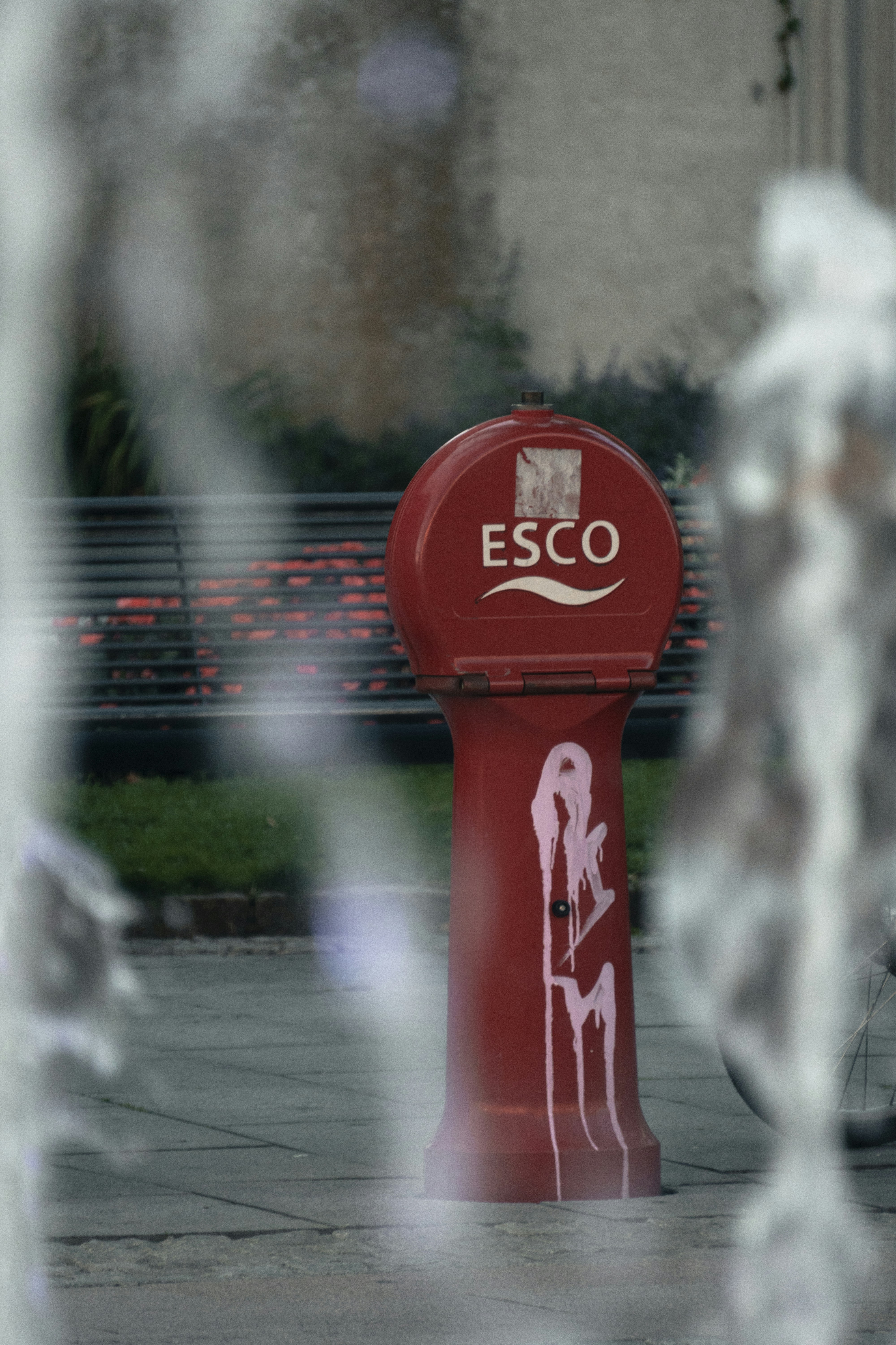 Red ESCO Mailbox Fragments: A Street-Scene through a Window Mesh