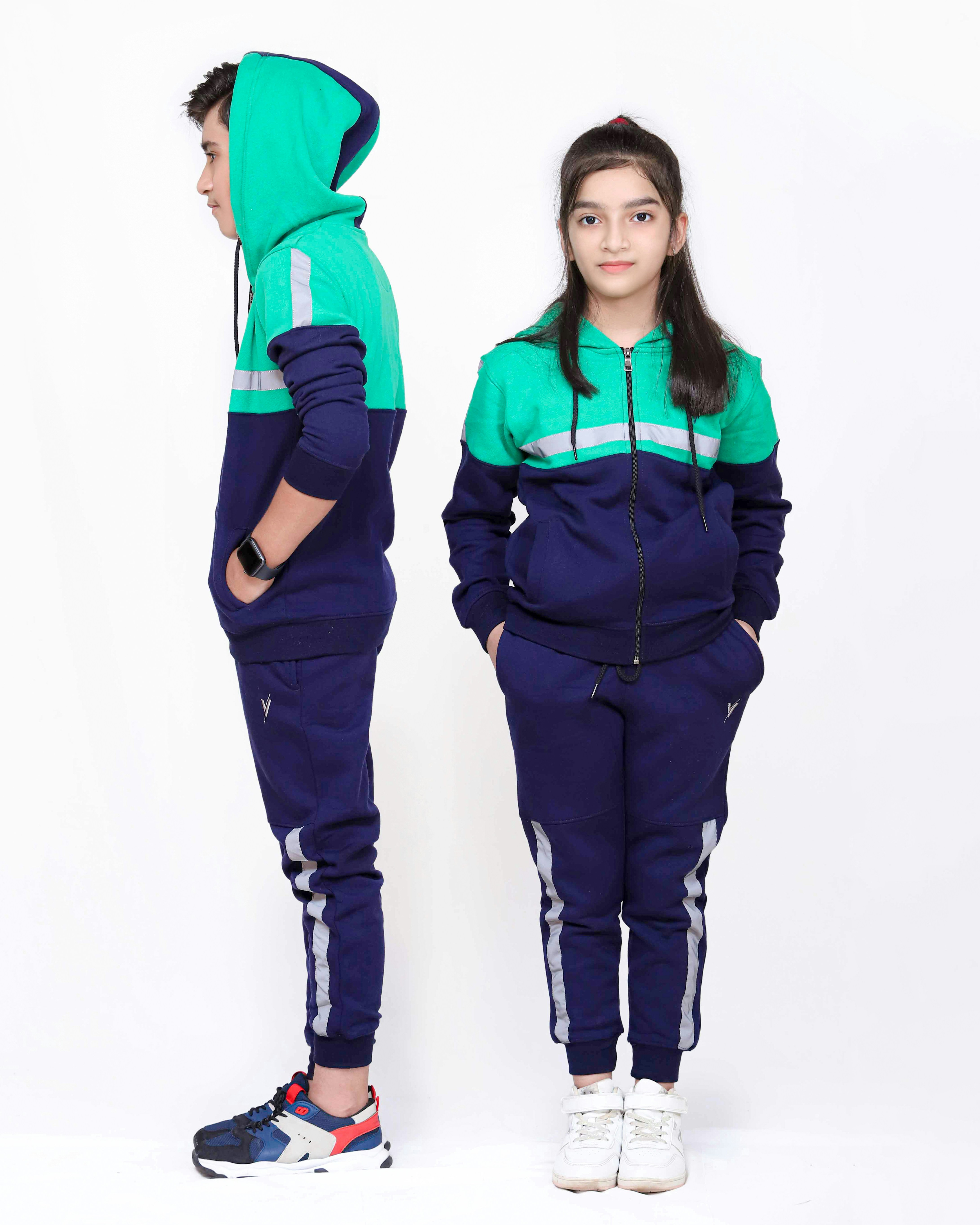 A young girl and boy in matching tracksuits photo – Free Apparel Image ...