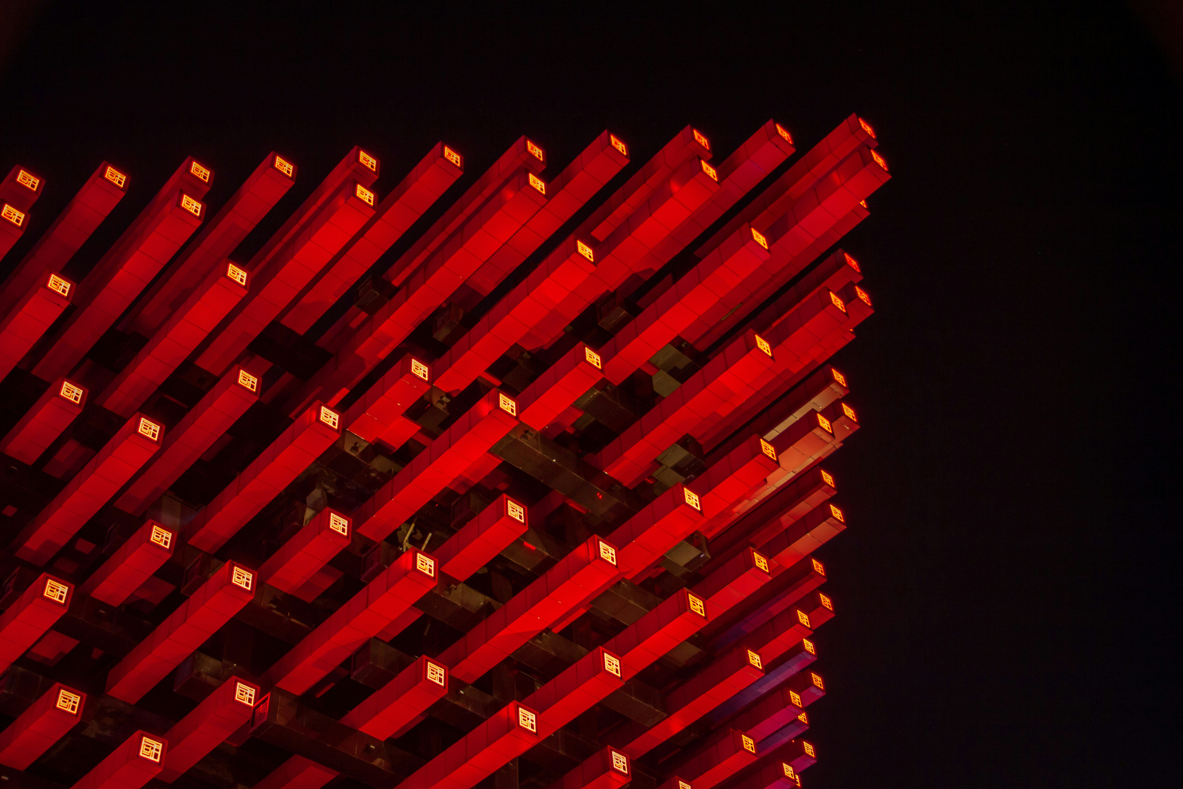 A large red structure is lit up at night photo – Free 中国重庆市 Image on ...