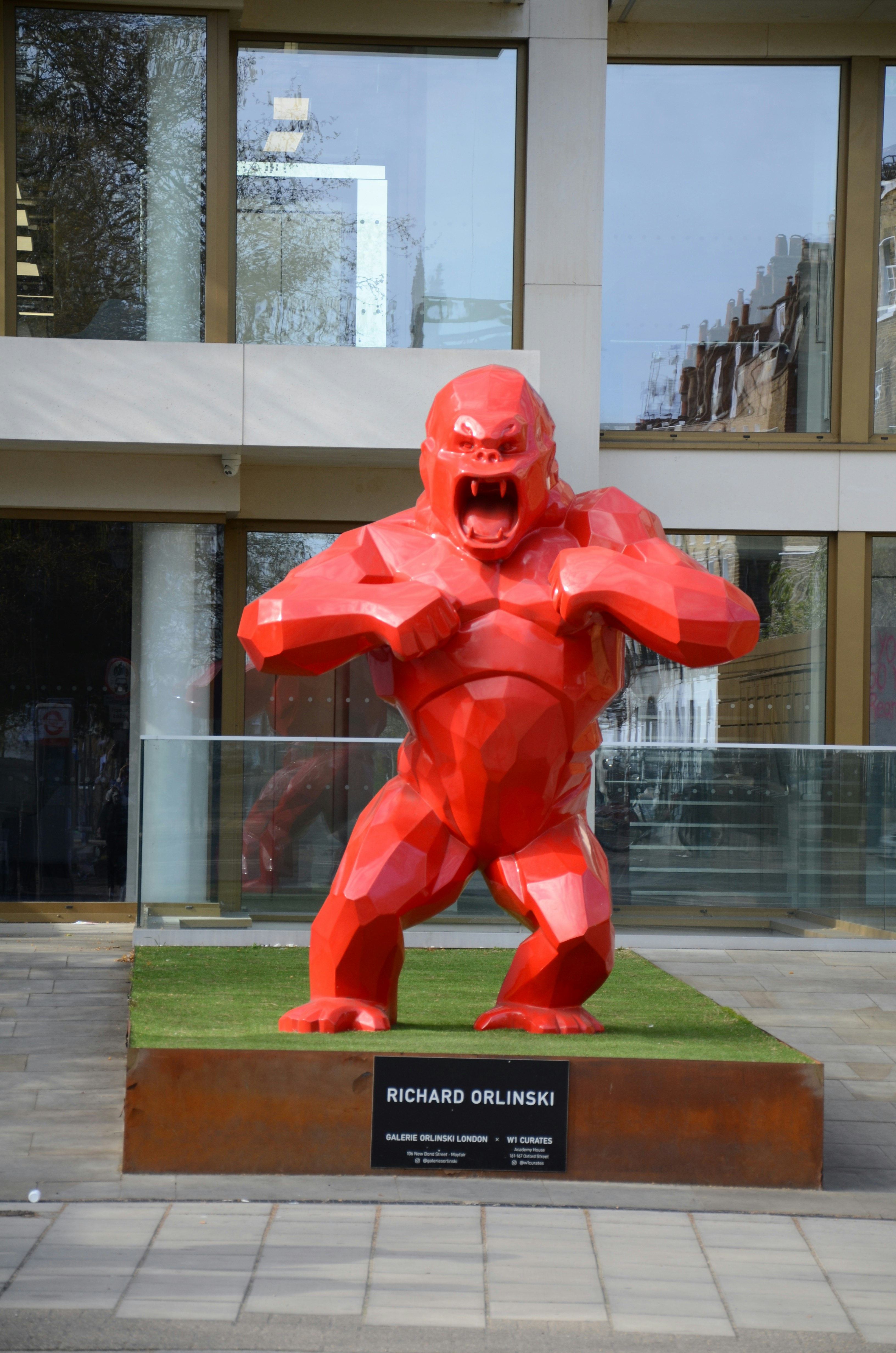 a statue of a man in a red suit