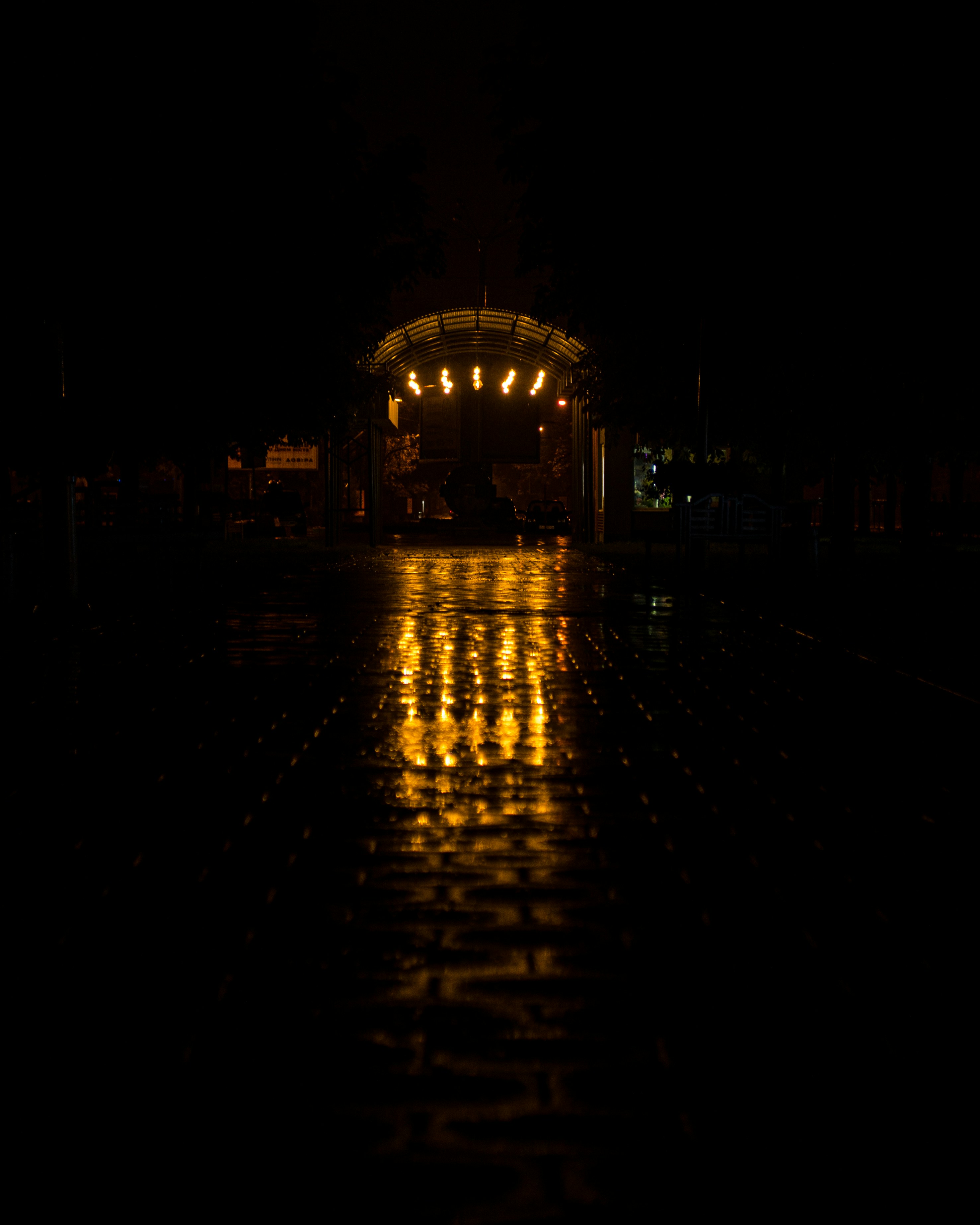 A stage lit up at night in the rain photo – Free Urban Image on Unsplash
