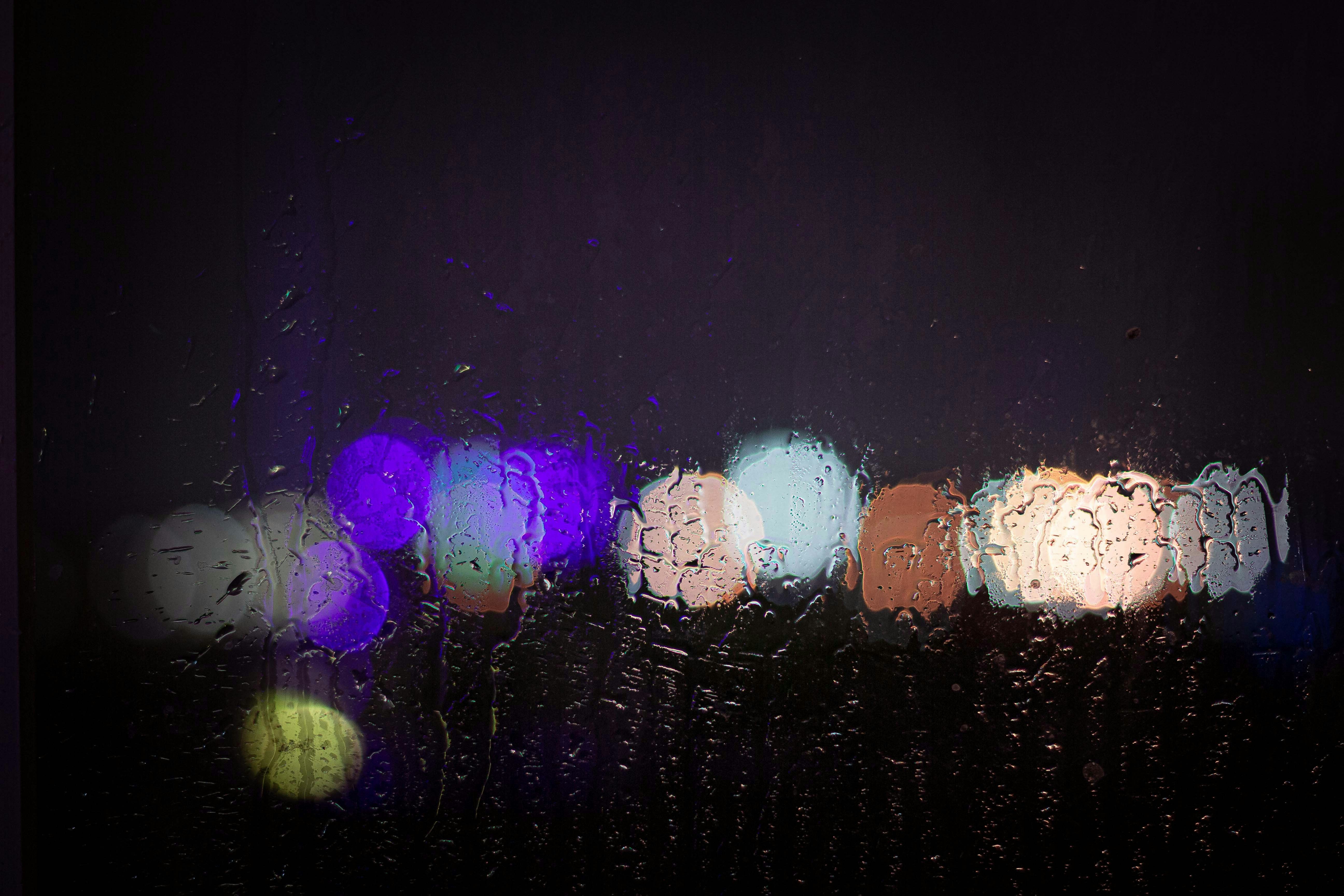 Nocturnal Symphony of Light Through Rain