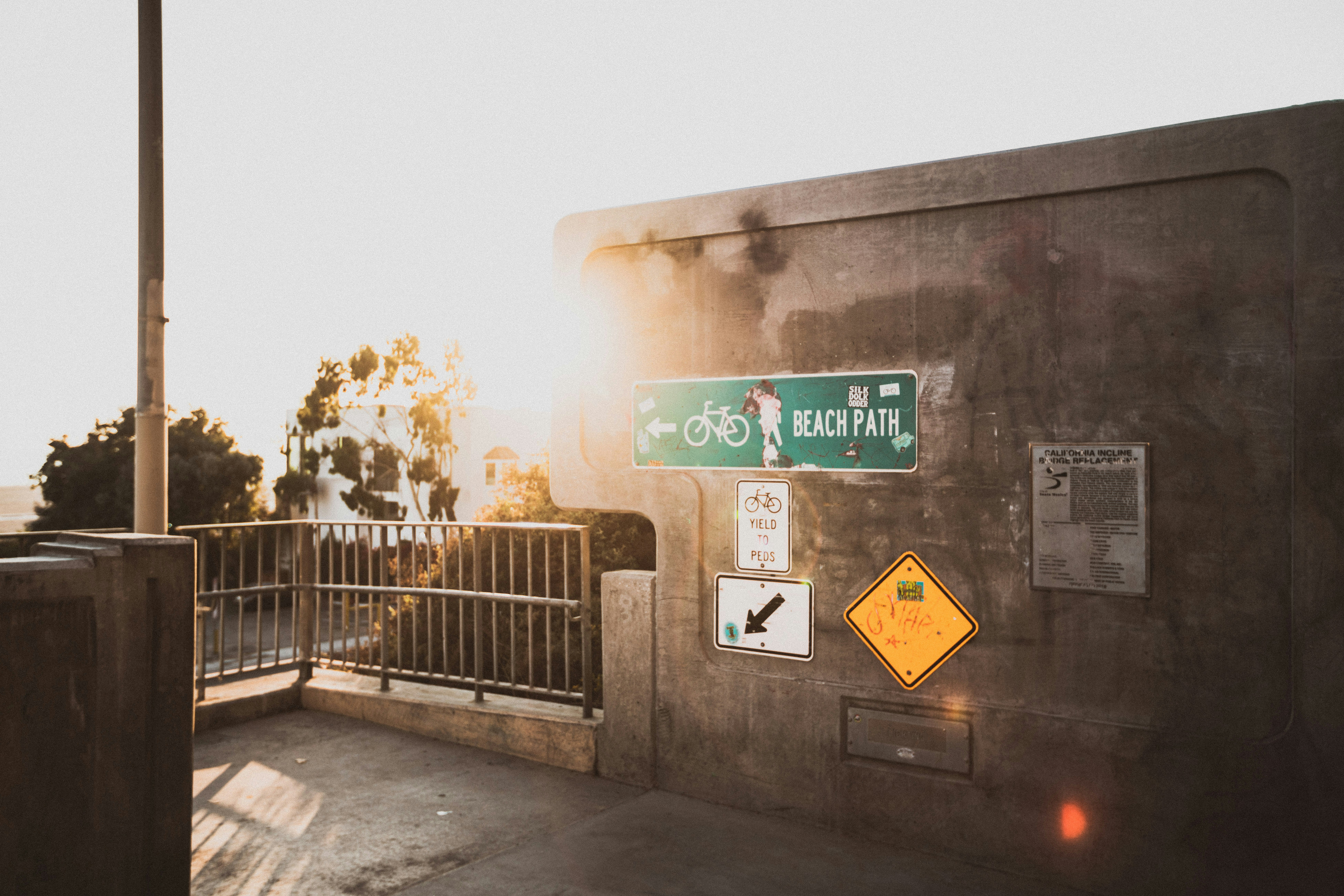 Sunlit Overpass Signage Framed by a Warm Sunset