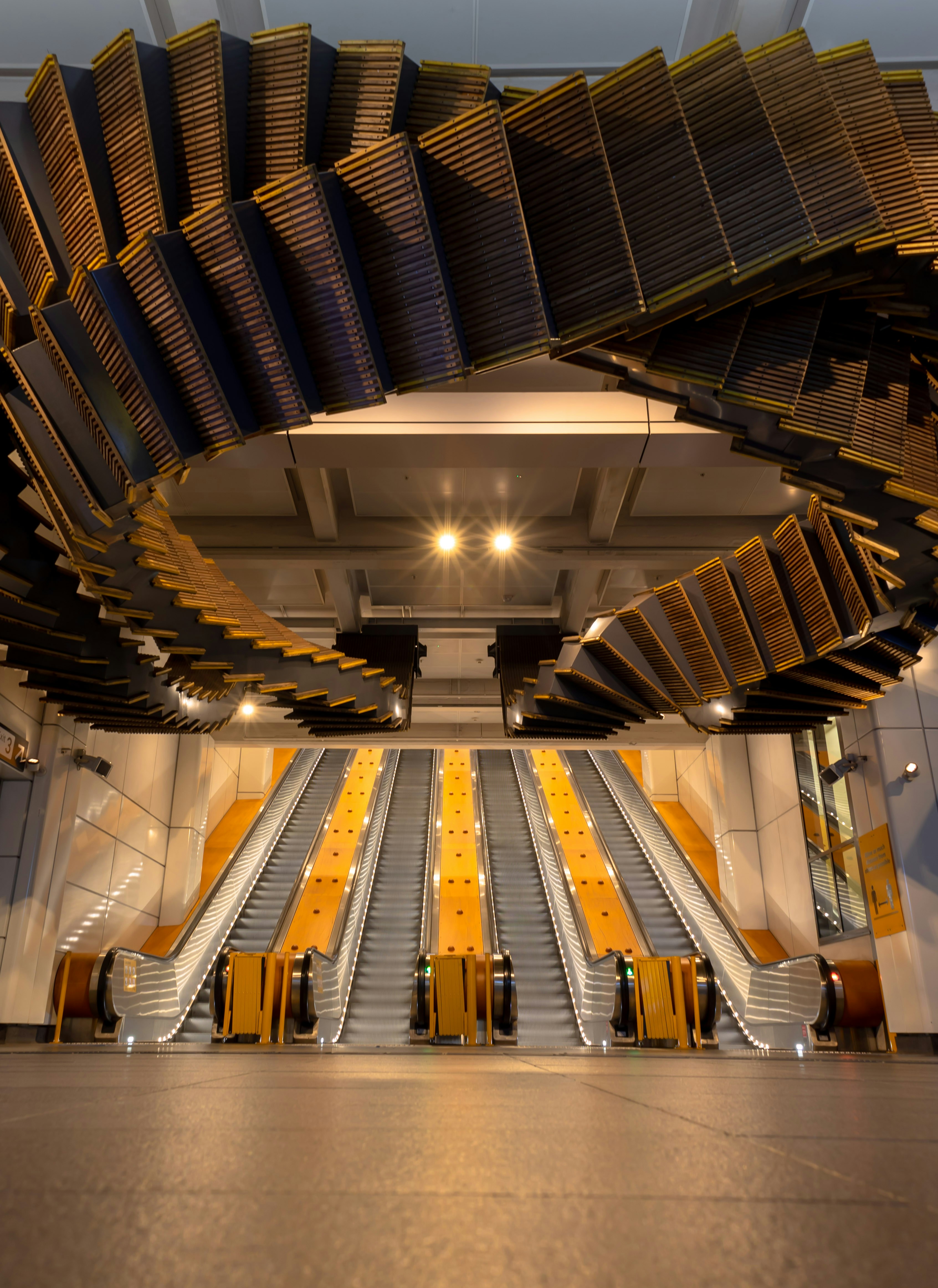 Concentric Waves: An Underground Atrium Framed by Golden Spiral Ribbons