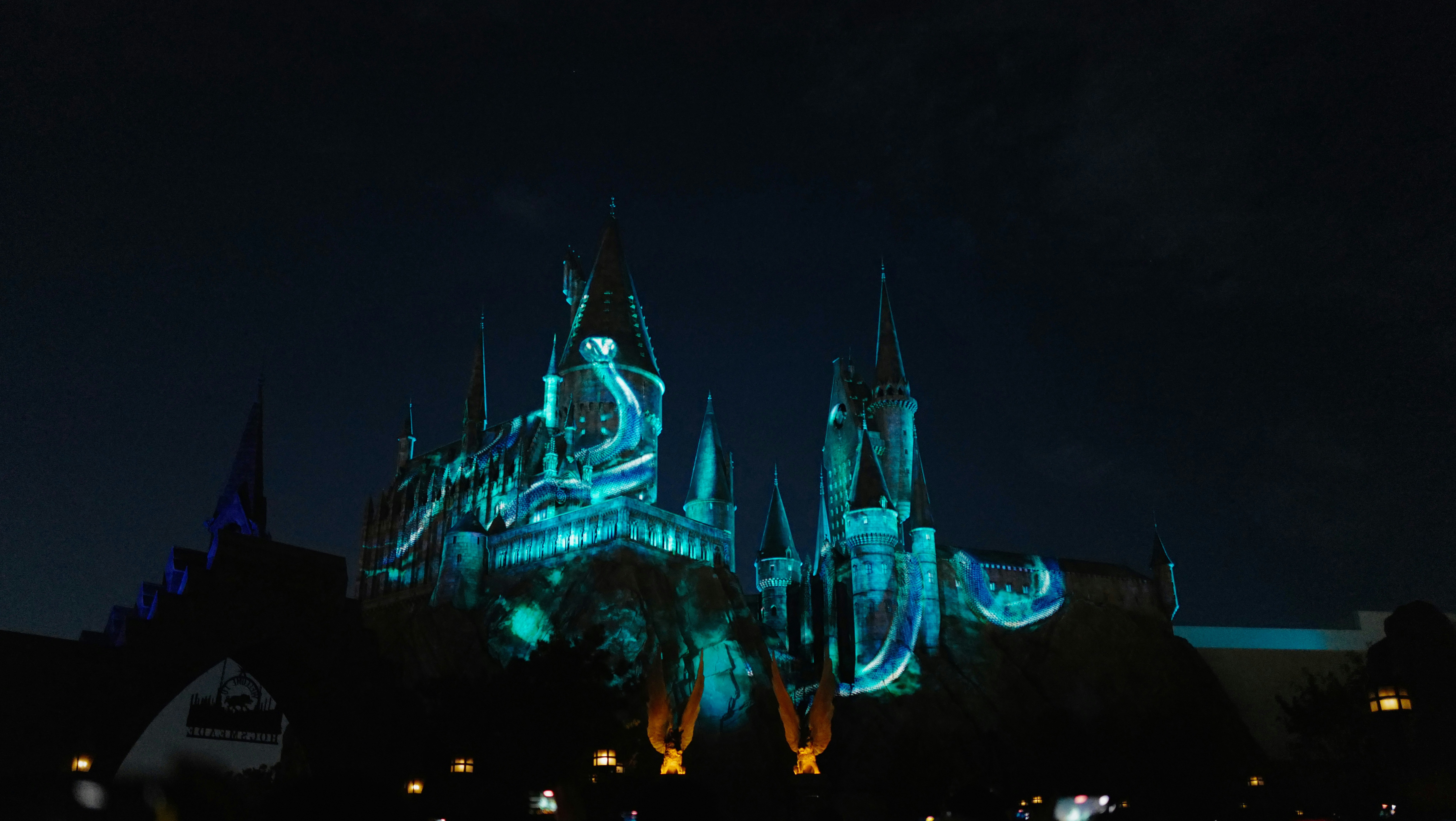 a castle lit up at night with lights on it