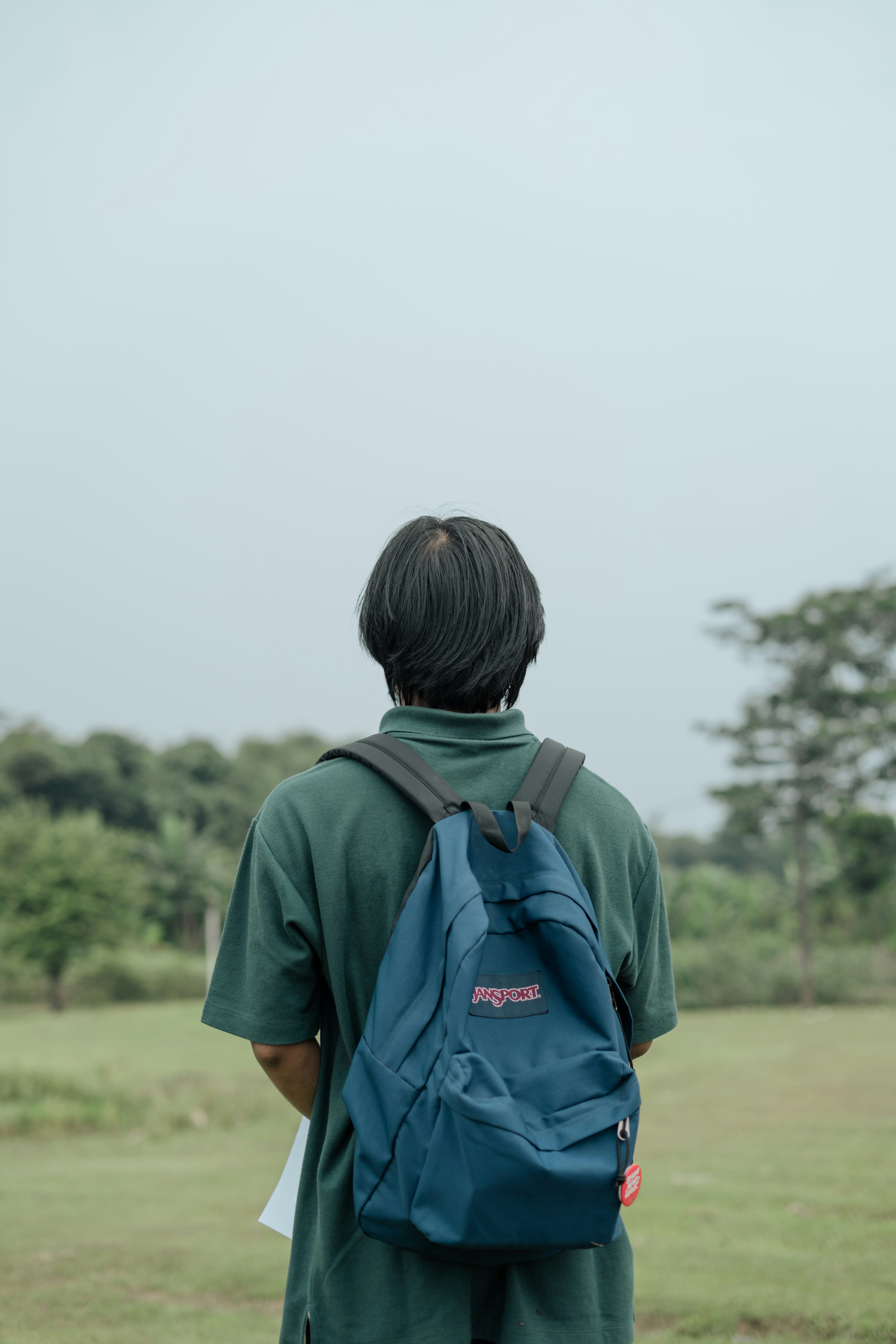Backpack Journey: A Quiet Stroll Through Green Pastures