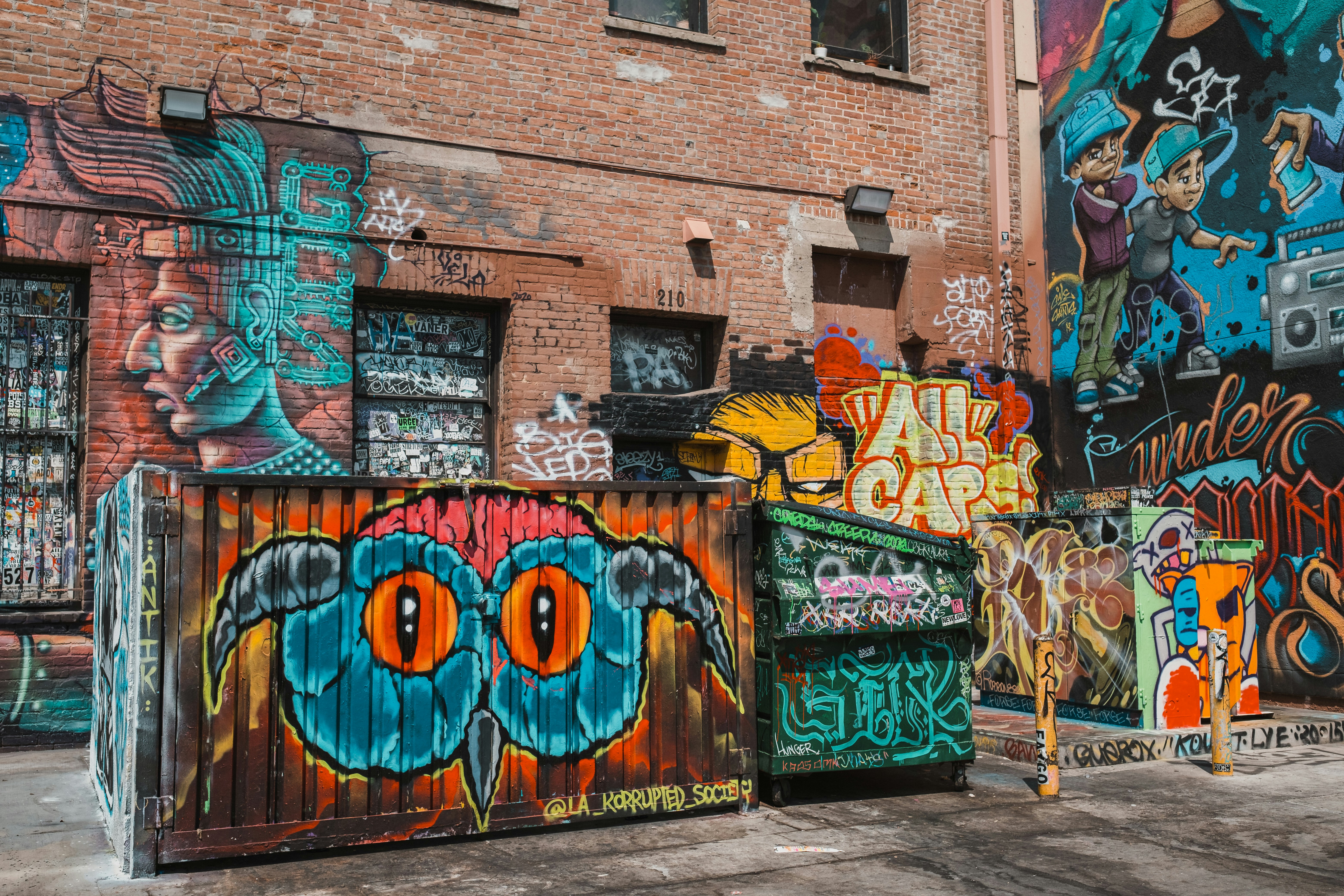 A bunch of graffiti on the side of a building photo – Free Santa ana ...