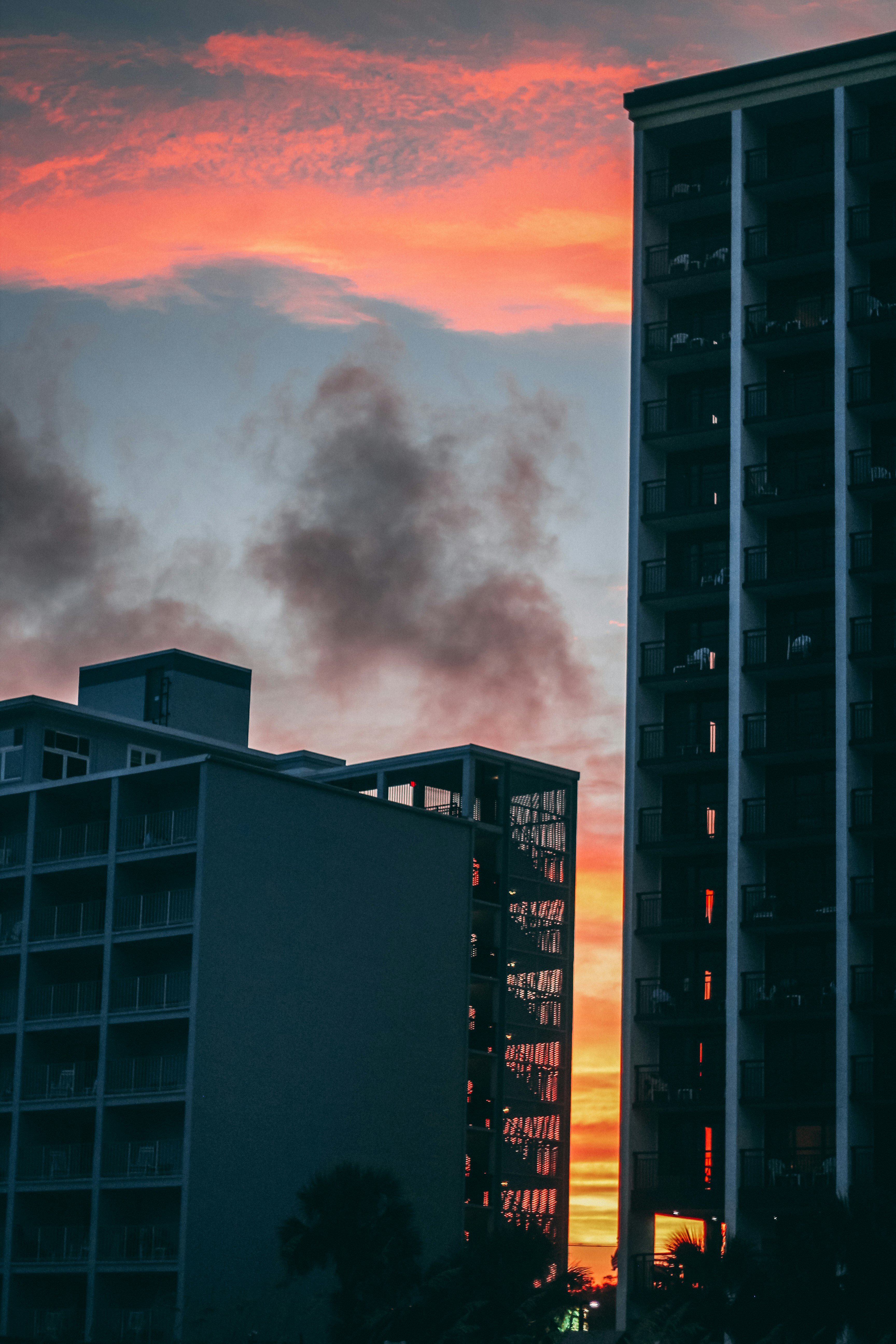 a very tall building sitting next to a tall building