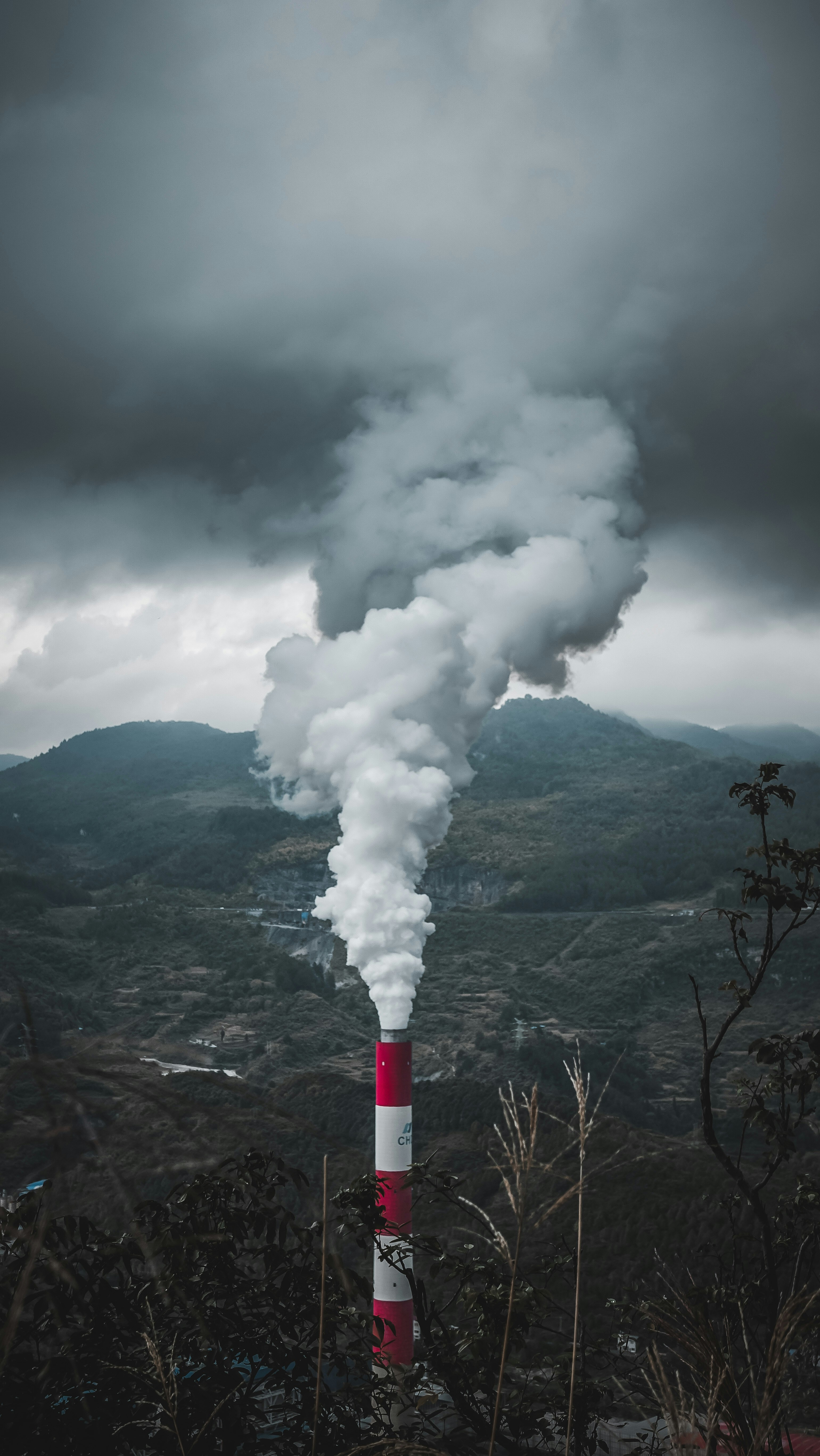 A red and white smokestack emits from a pipe photo – Free Nature Image ...