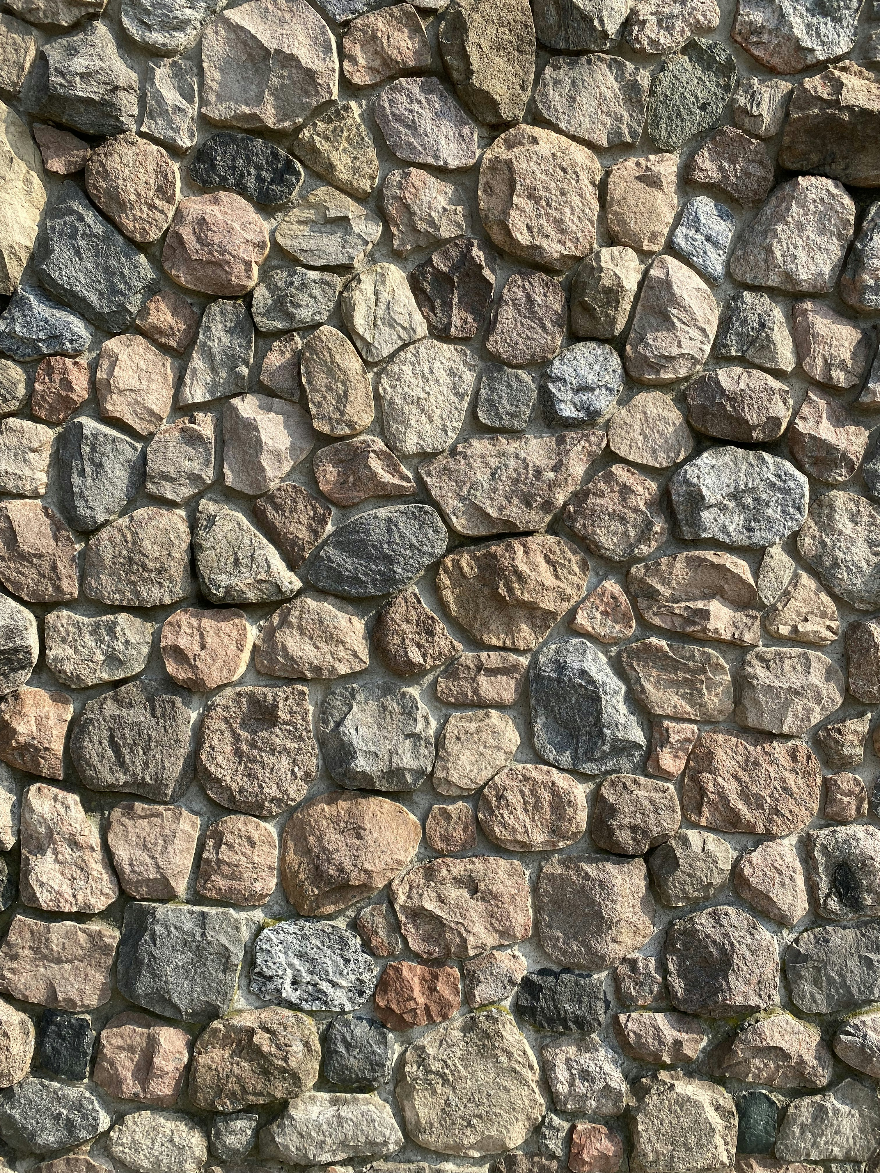 Un muro de piedra hecho de rocas y grava foto – Imagen de Pared ...