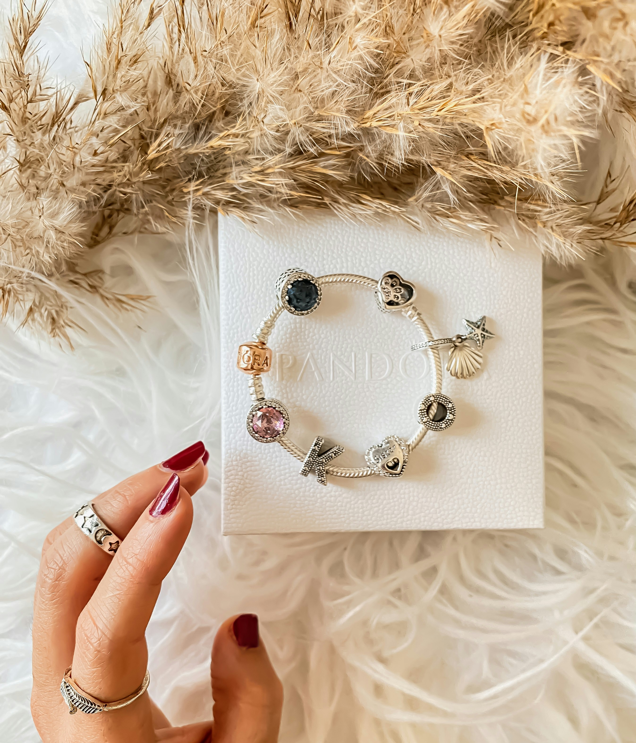 Sparkling Charm: A Delicate Bracelet Resting on a Gift Box