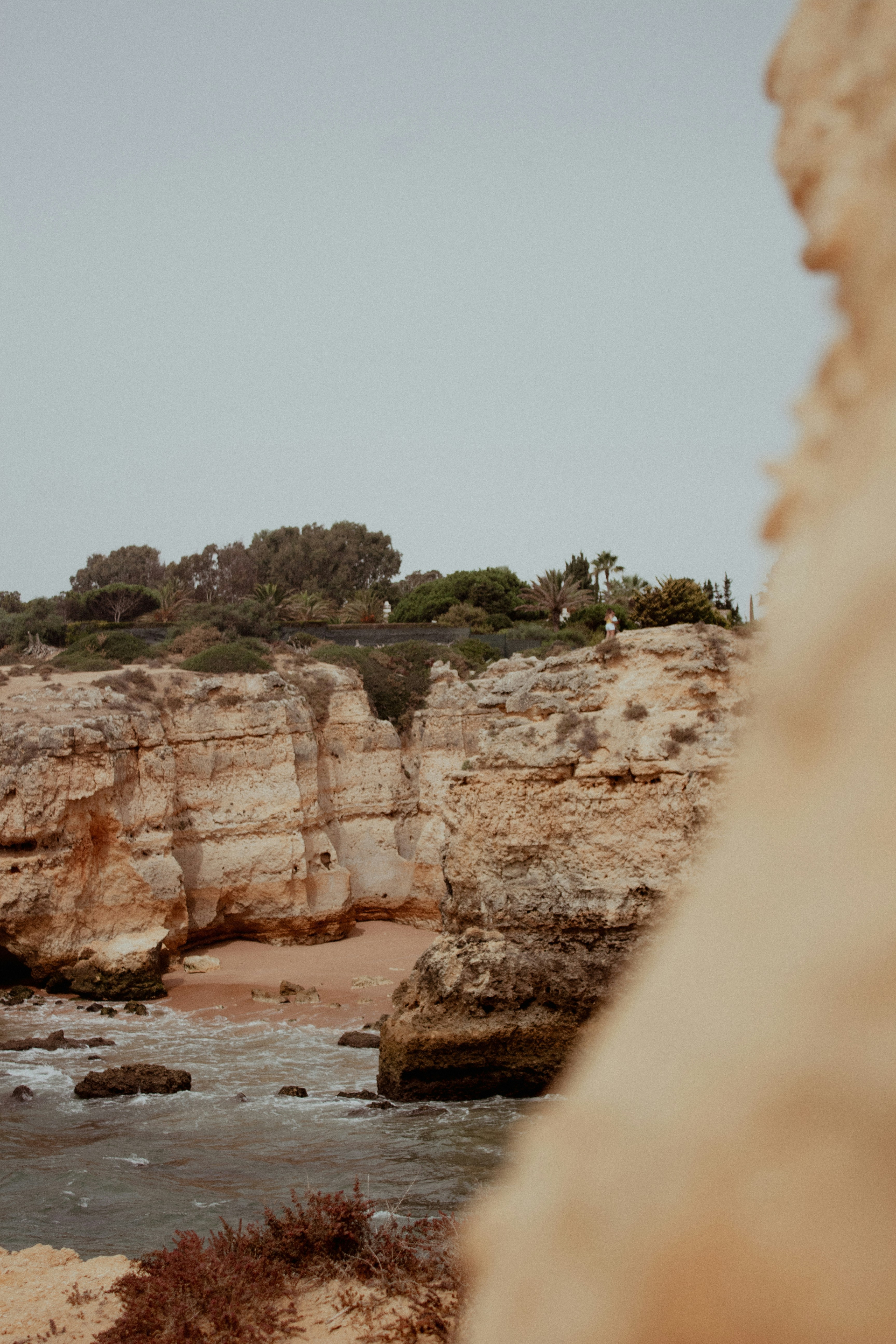 Promontory Portrait: A Cliffside Vista with a Tiny Silhouette