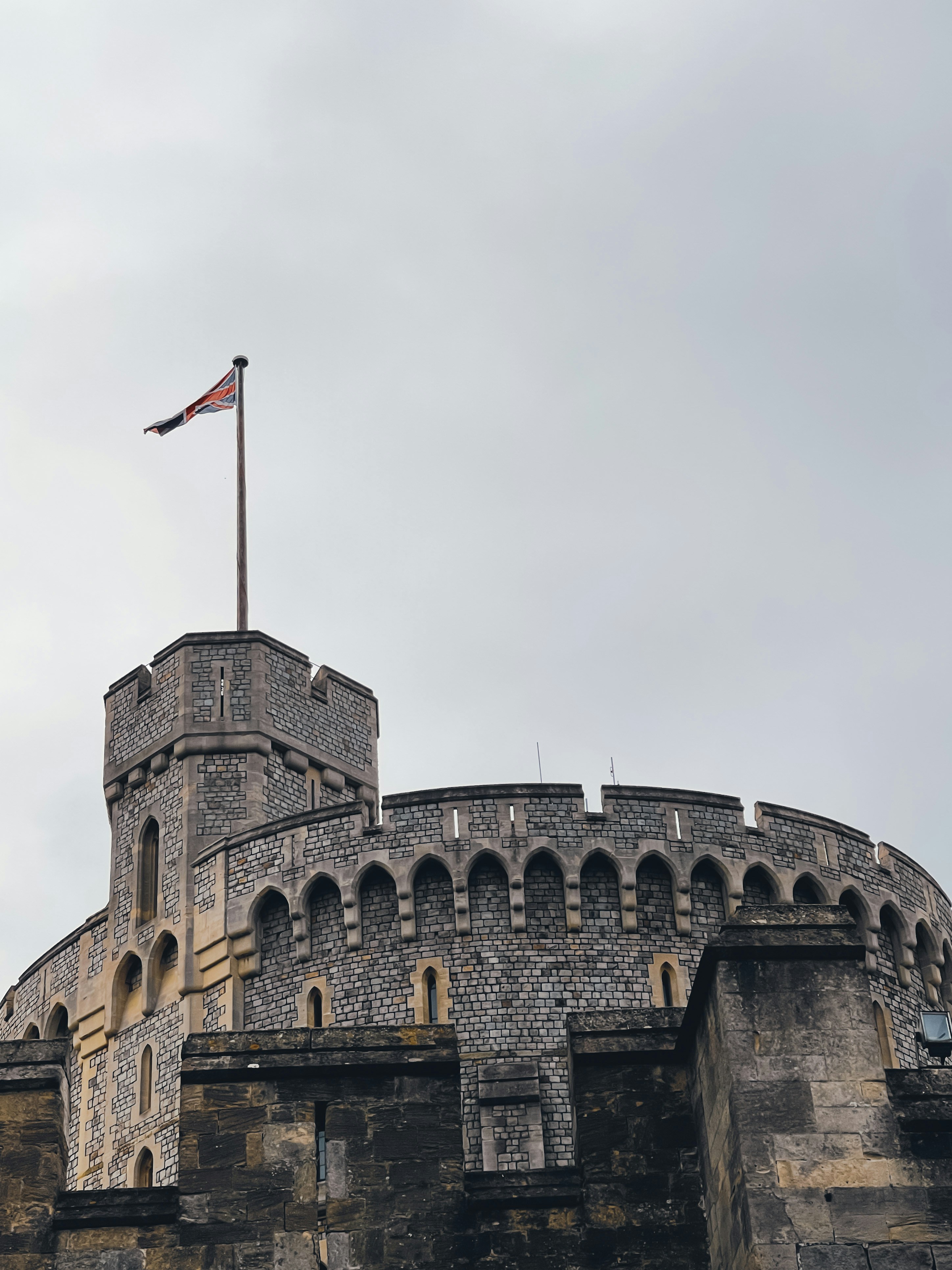 A flag is flying on top of a castle photo – Free Building Image on Unsplash